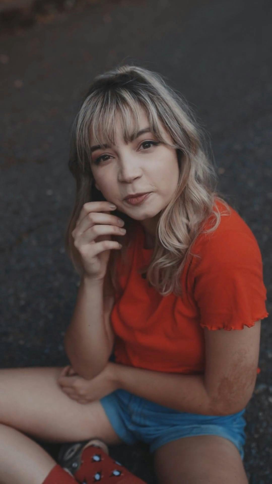A Woman Showing Different Facial Expressions In Front Of The Camera ...