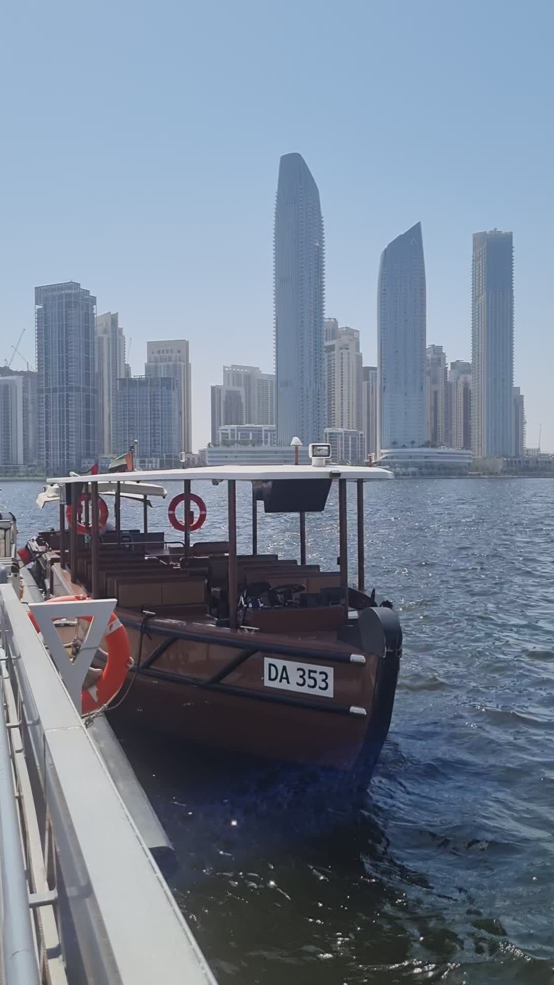 Traditional Boat on Abu Dhabi Waterfront with Skyscrapers Free Stock ...