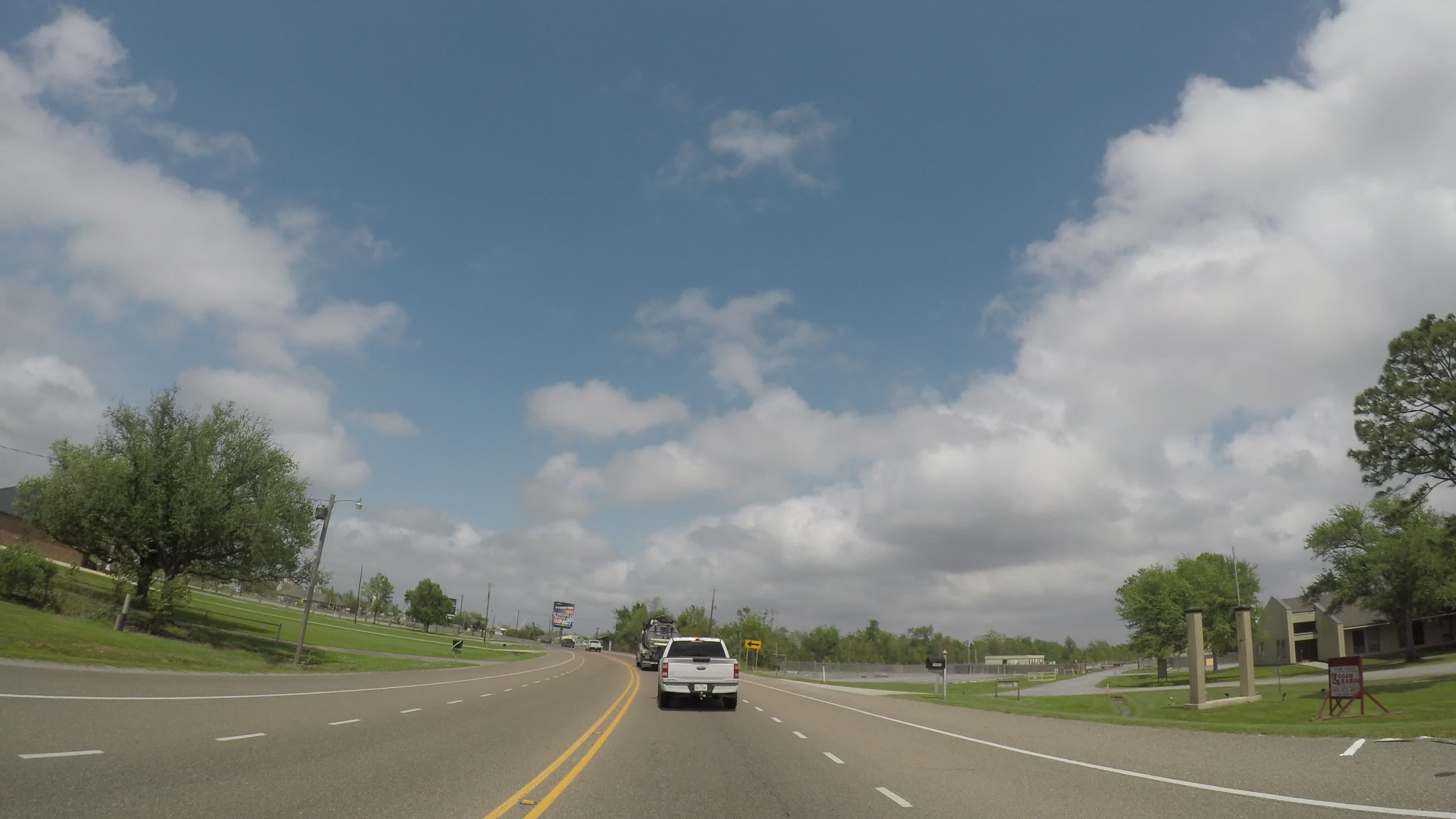 Scenic Drive Through Suburban Roads with Clear Skies Free Stock Video ...