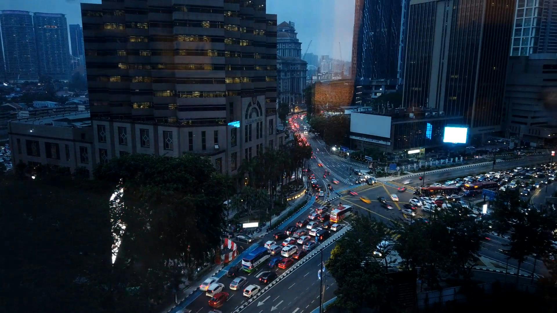 Motor Vehicles Traffic On A Busy Road Intersection In Kuala Lumpur ...