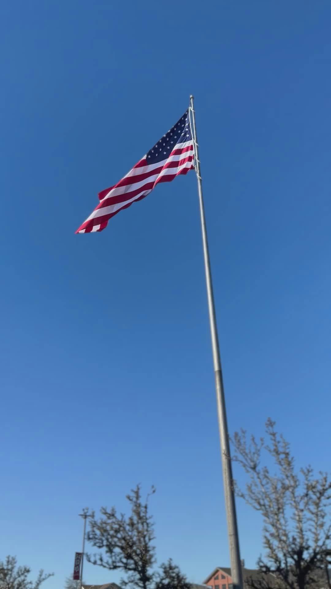 An American Flag Raised High Above The Flag Pole Free Stock Video ...