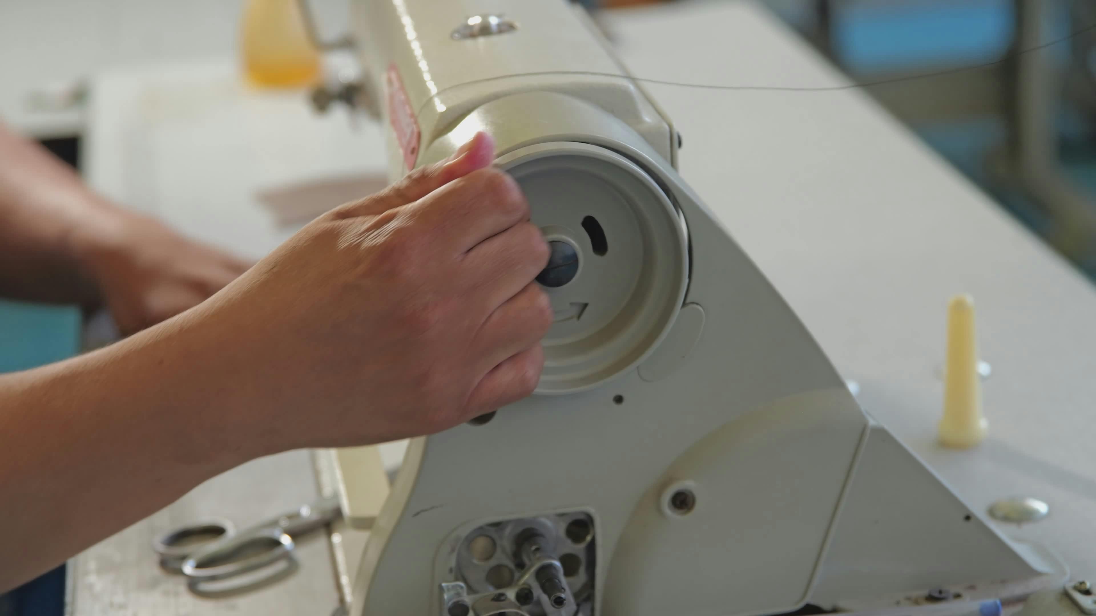 Skilled Hands Operating Sewing Machine in Workshop Free Stock Video ...