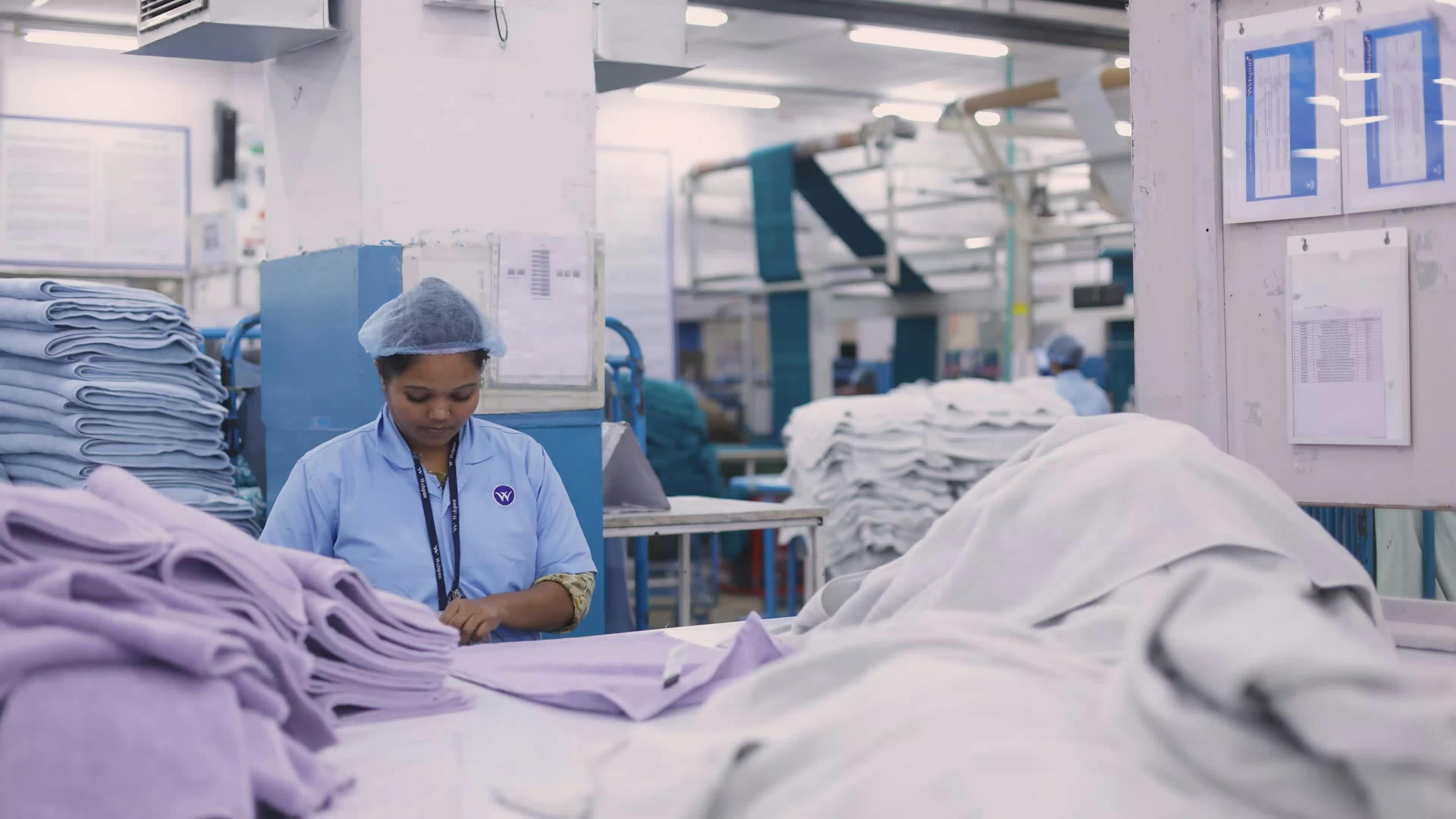 Textile Factory Worker Organizing Fabrics Free Stock Video Footage ...