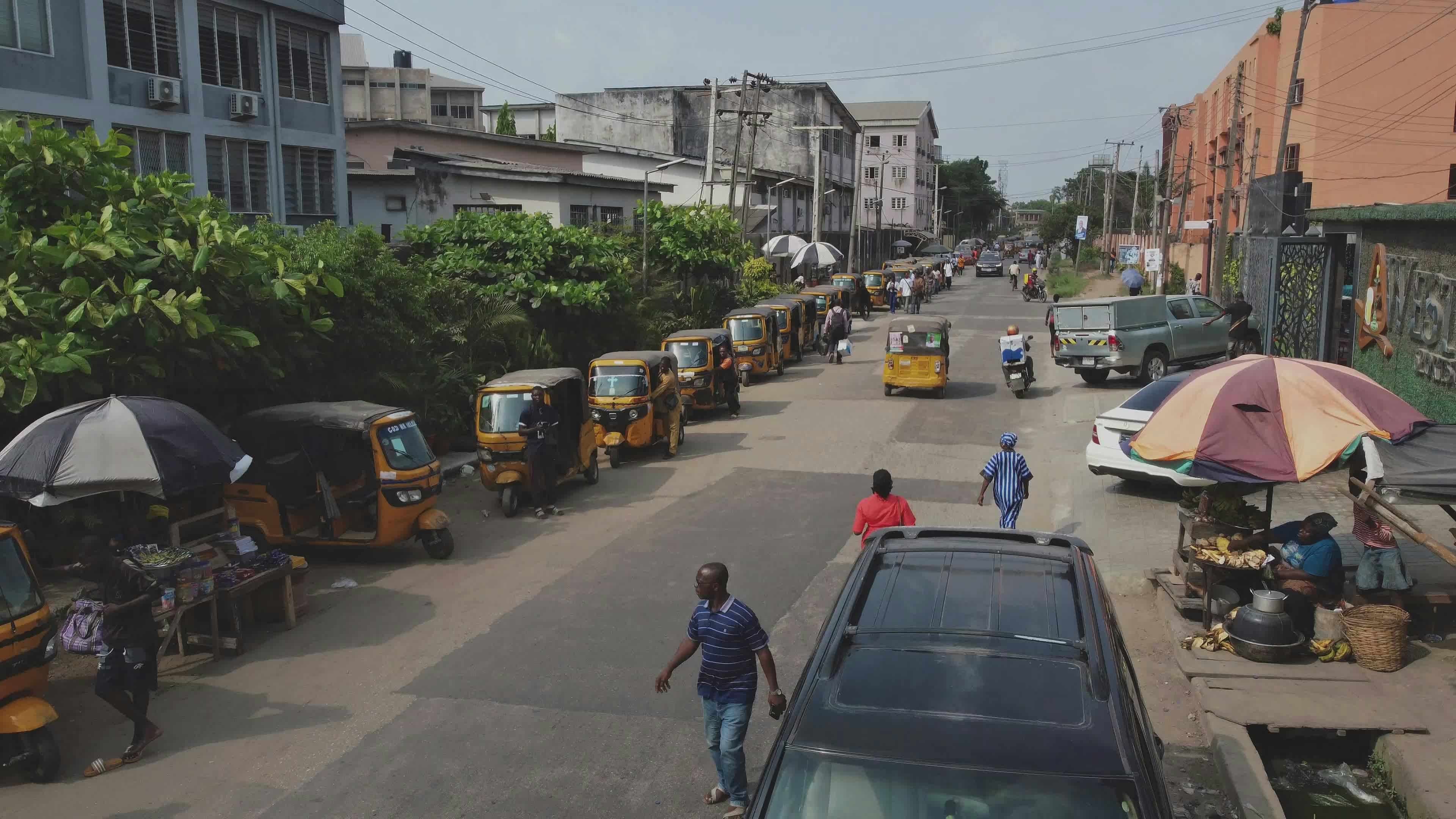 Busy Lagos Street with Tricycles and Pedestrians Free Stock Video ...