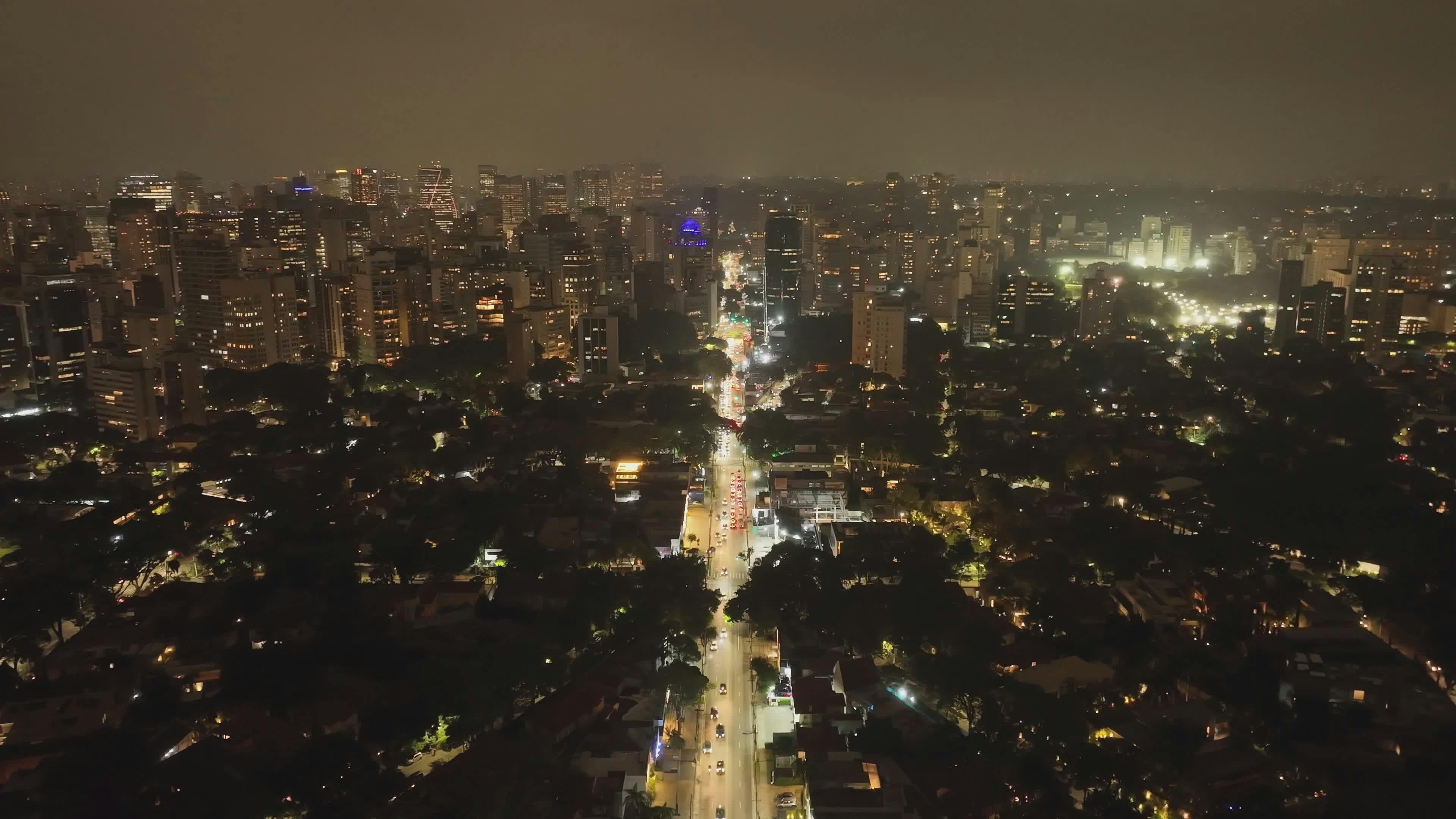 Aerial Night View of City Skyline with Busy Streets Free Stock Video ...