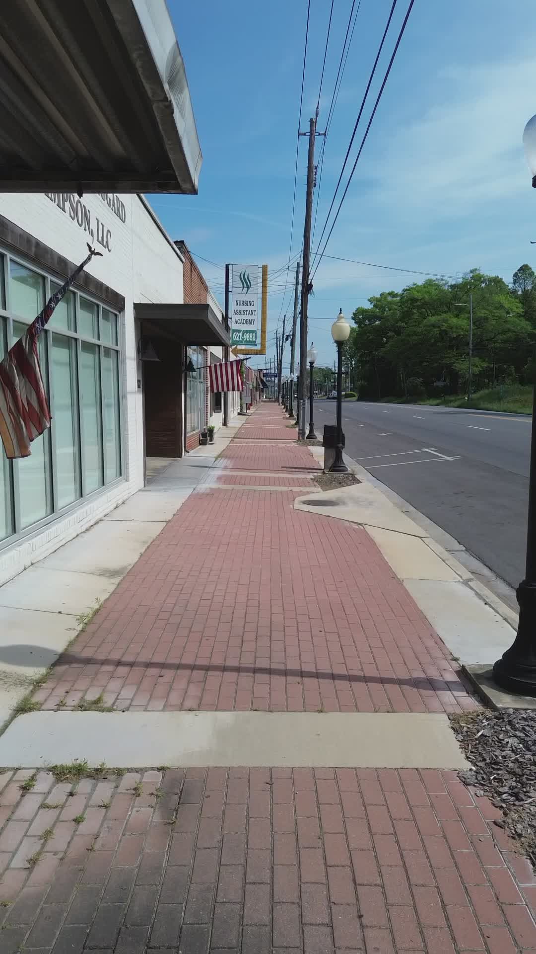 Quiet Small Town Street with Red Brick Sidewalk Free Stock Video ...