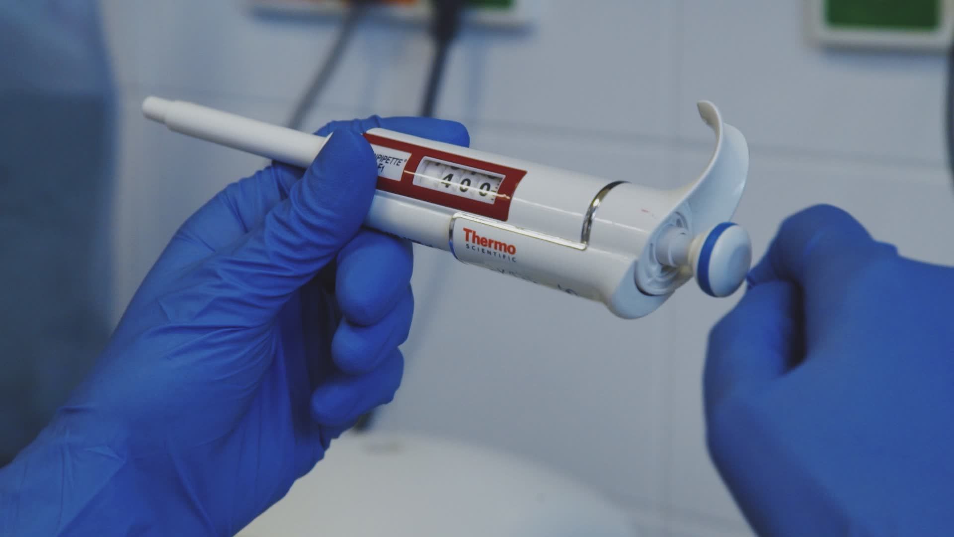 Scientist Adjusting Laboratory Pipette for Experiment Free Stock Video ...
