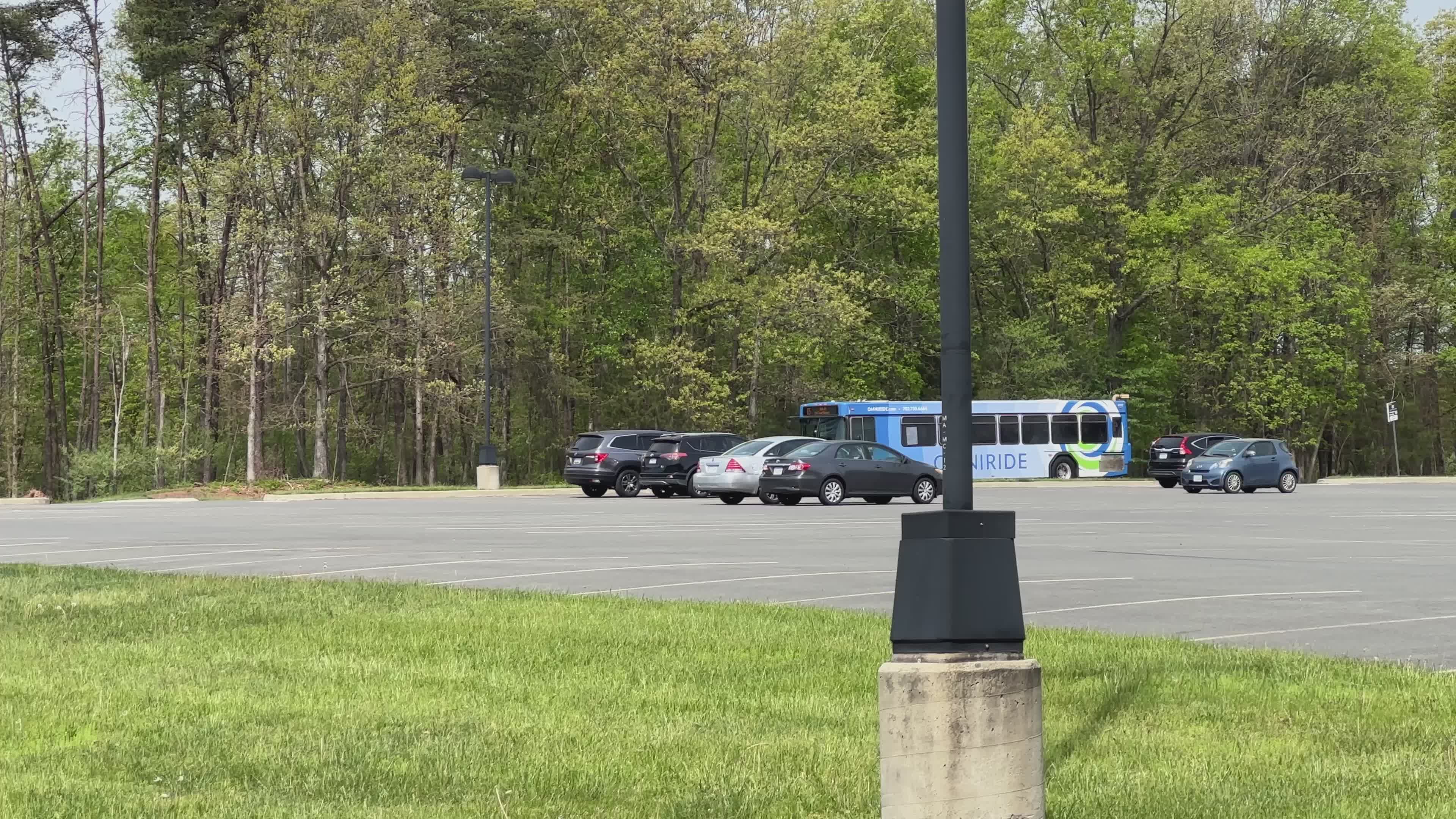 Blue Bus in Parking Lot with Surrounding Cars Free Stock Video Footage ...