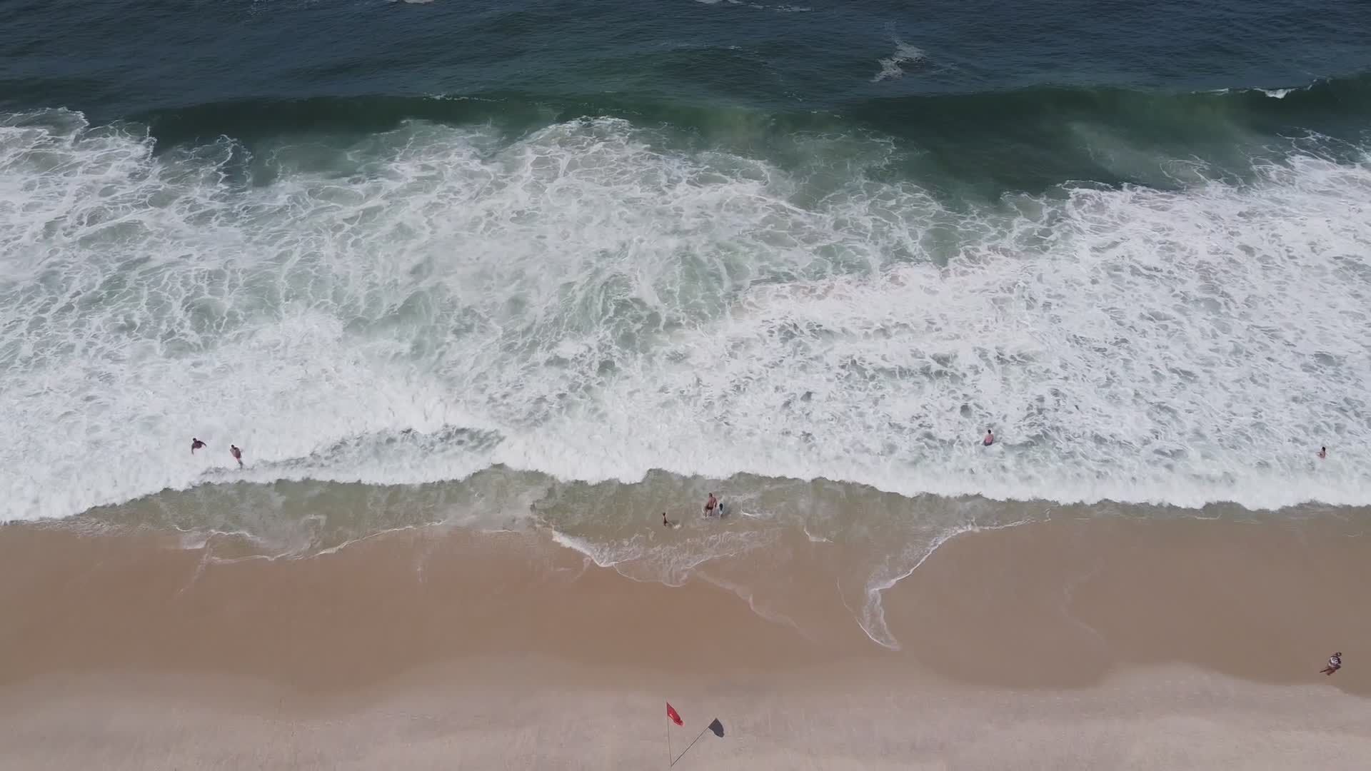 Aerial View of Beach with Waves and Sunbathers Free Stock Video Footage ...