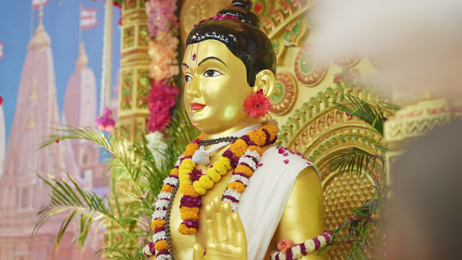Golden Hindu Deity Statue Adorned with Flowers Free Stock Video Footage ...