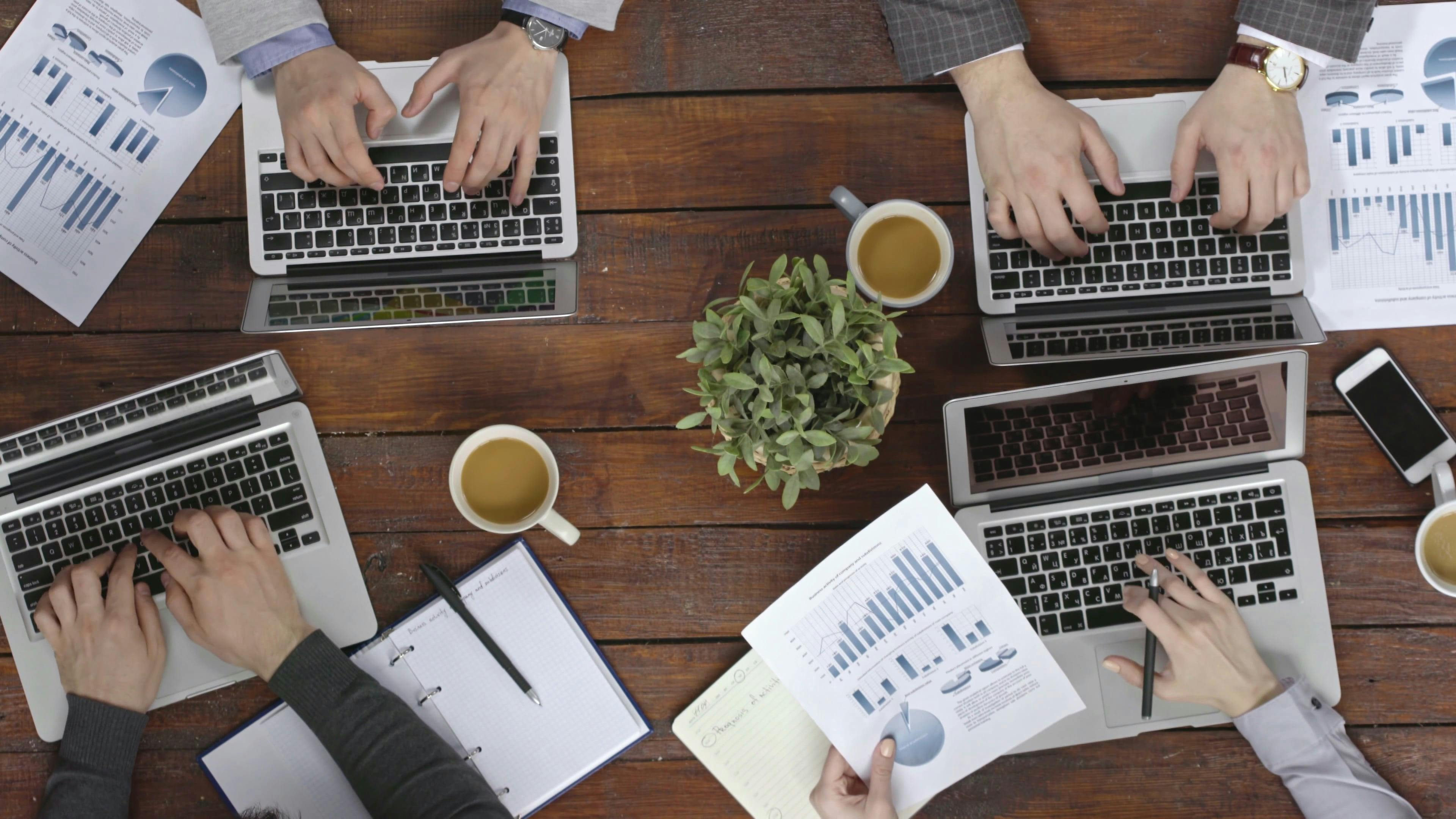 A Group Of People Busy Typing On Their Laptop Keyboards · Free Stock Video