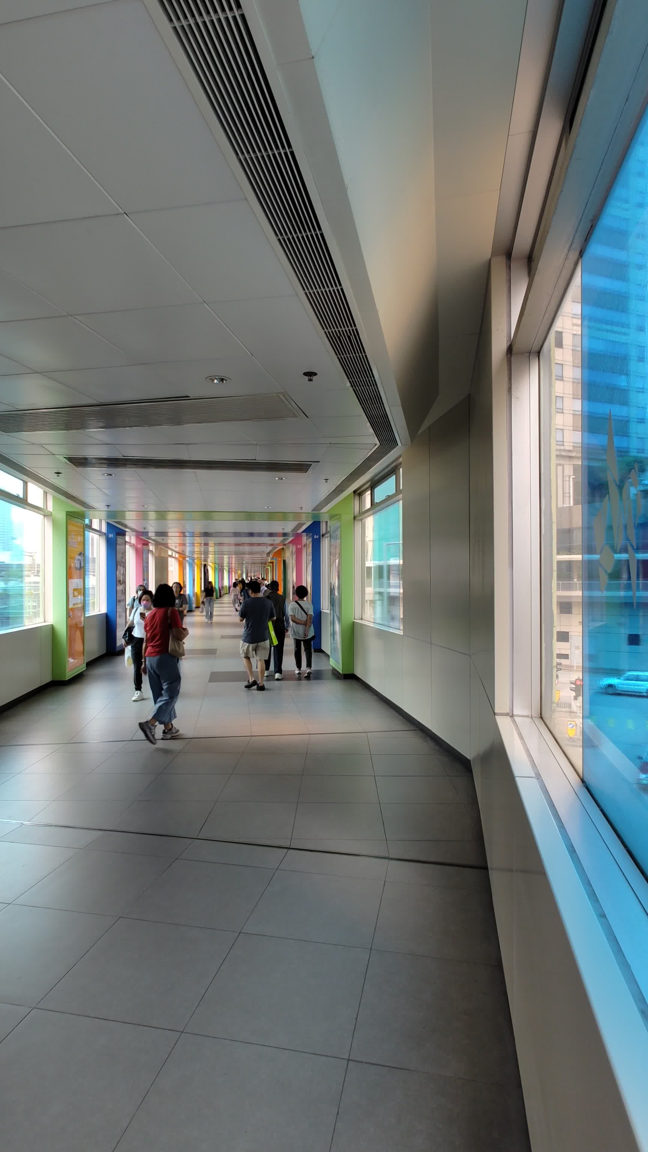 Vibrant Indoor Walkway with Diverse People Passing By Free Stock Video ...