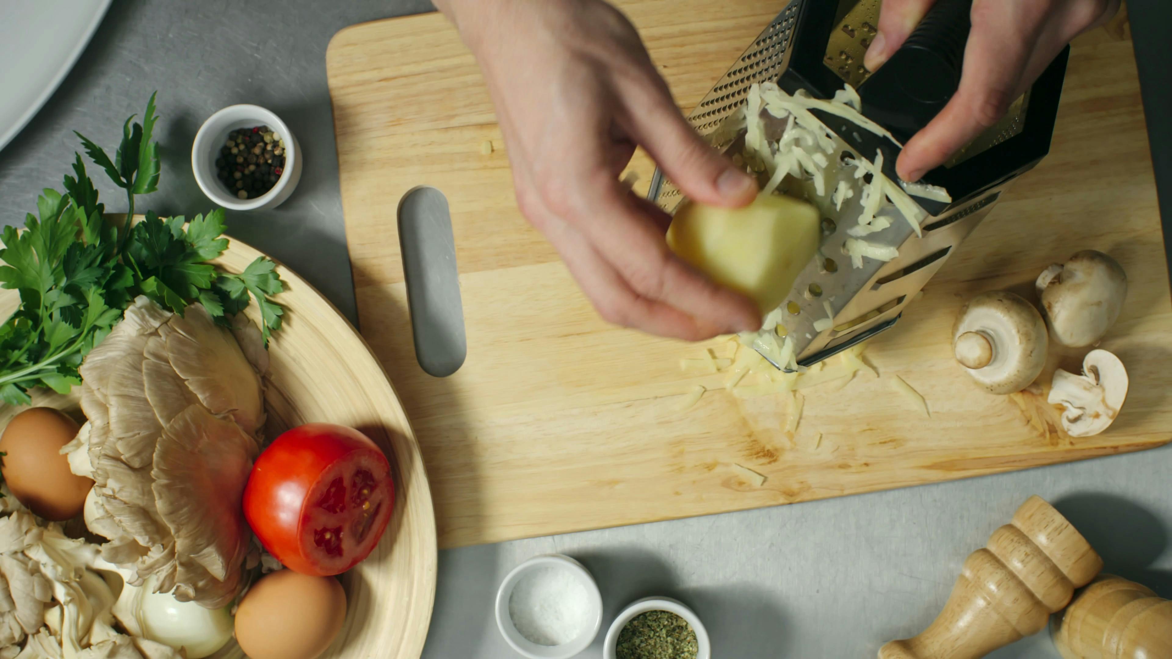Person Grating A Potato · Free Stock Video