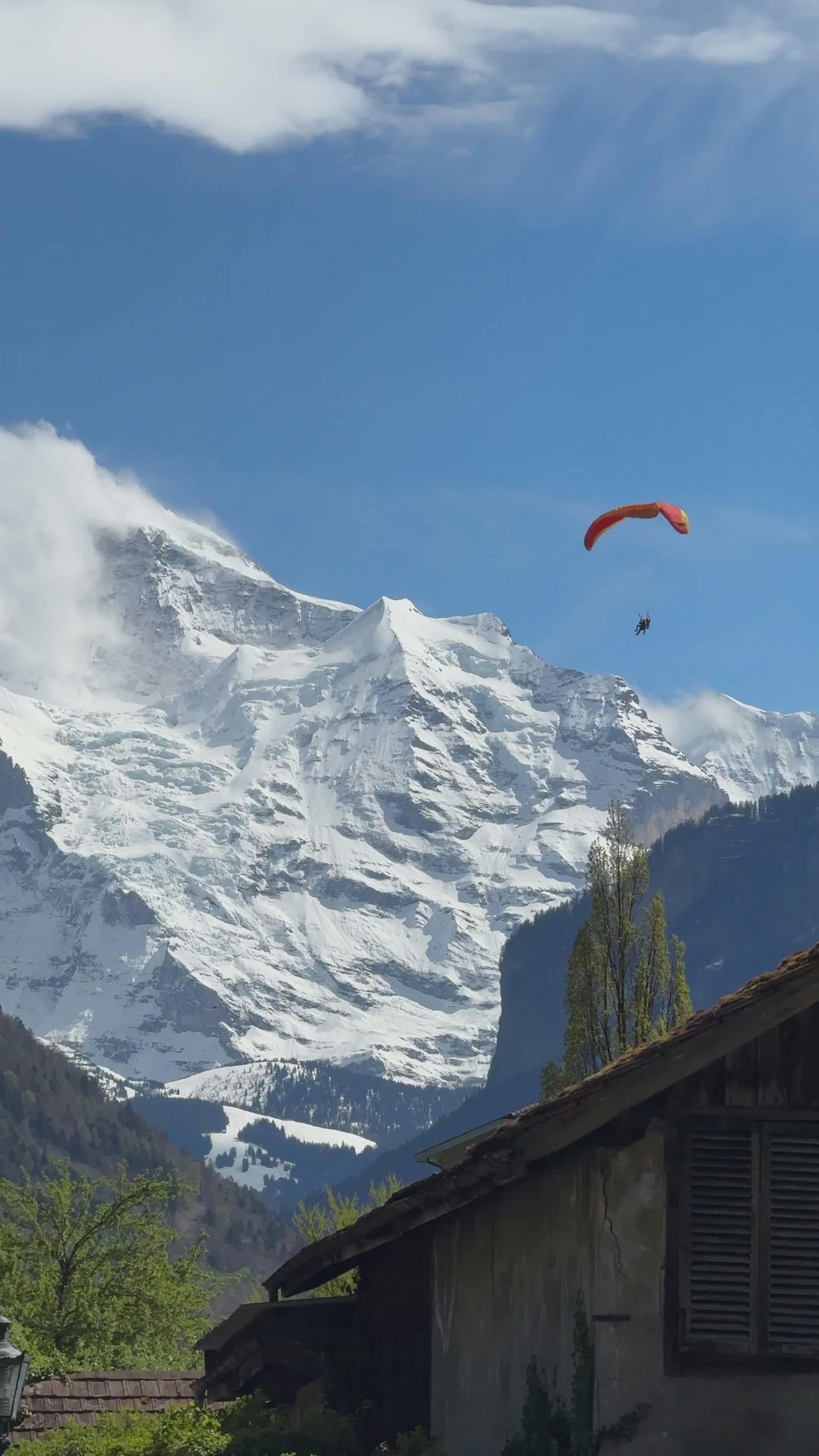 Paragliding Adventure Near Majestic Snow Mountains Free Stock Video ...