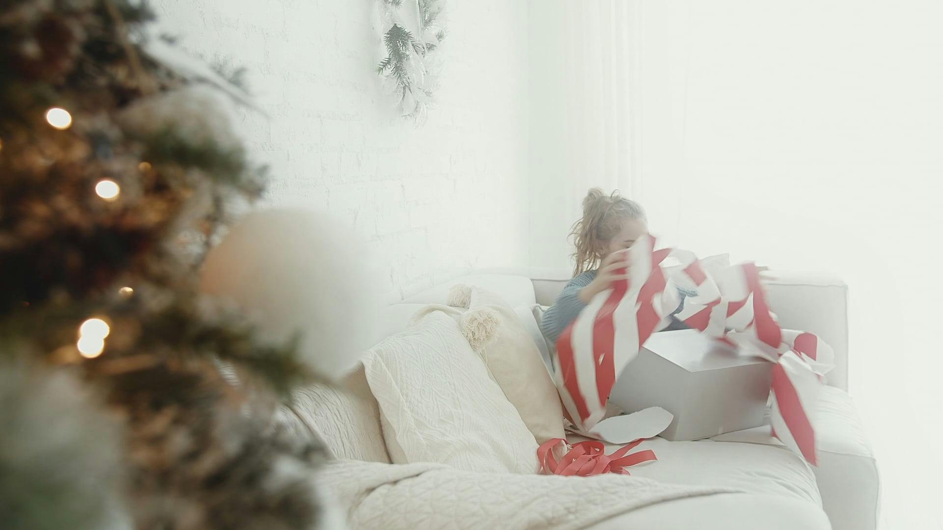 A Girl Ripping Off The Wrappers Of Her Christmas Gift Free Stock Video ...
