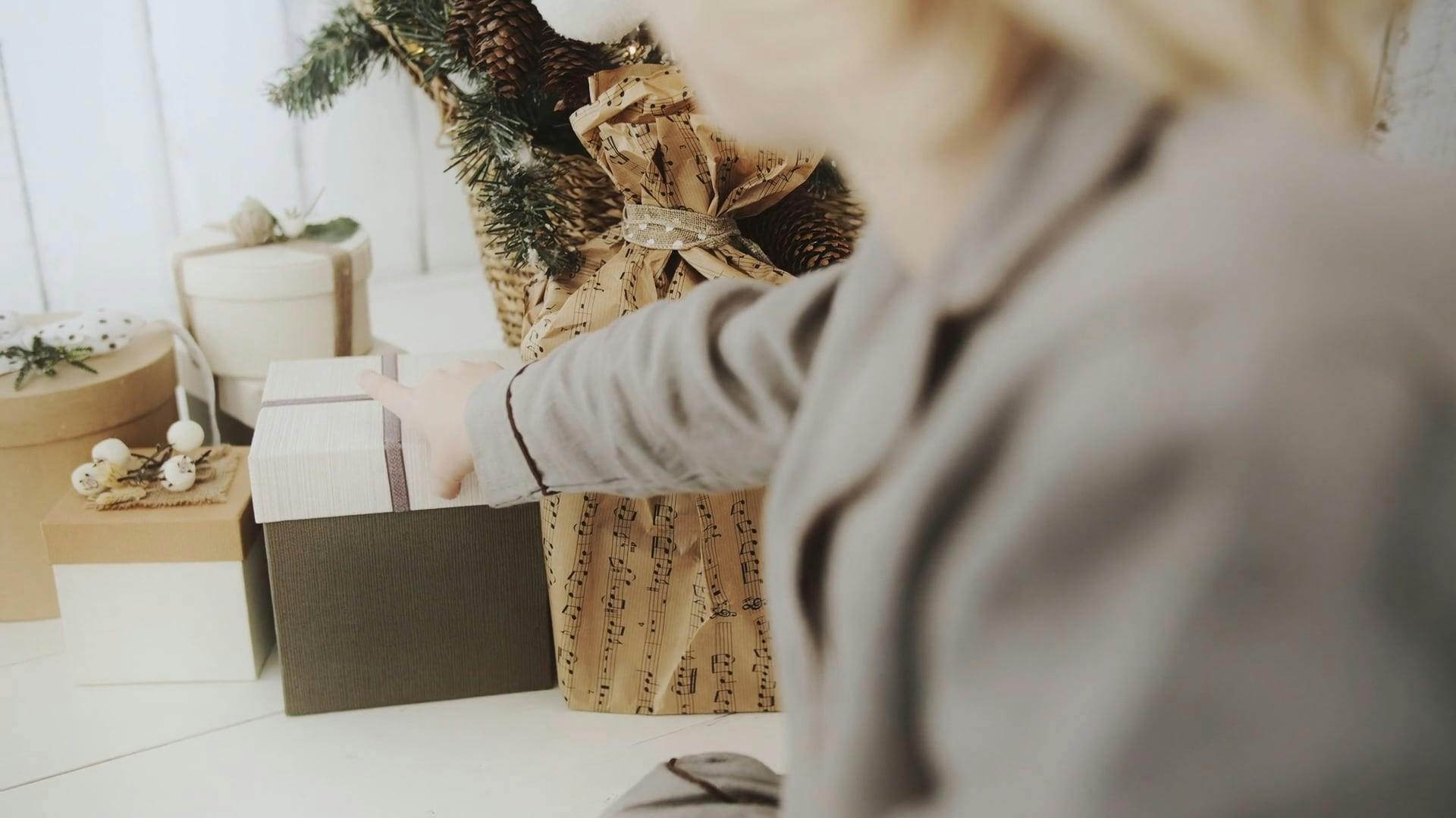 A Girl Ripping Off The Wrappers Of Her Christmas Gift · Free Stock Video