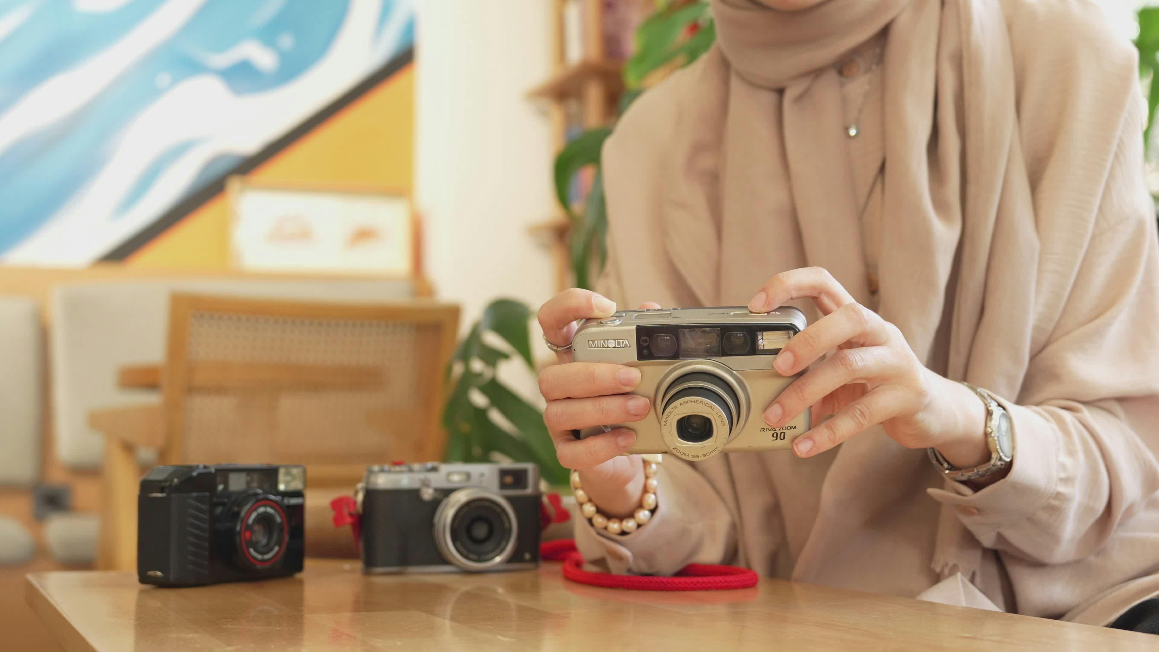 Woman Exploring Vintage Cameras Indoors Free Stock Video Footage ...