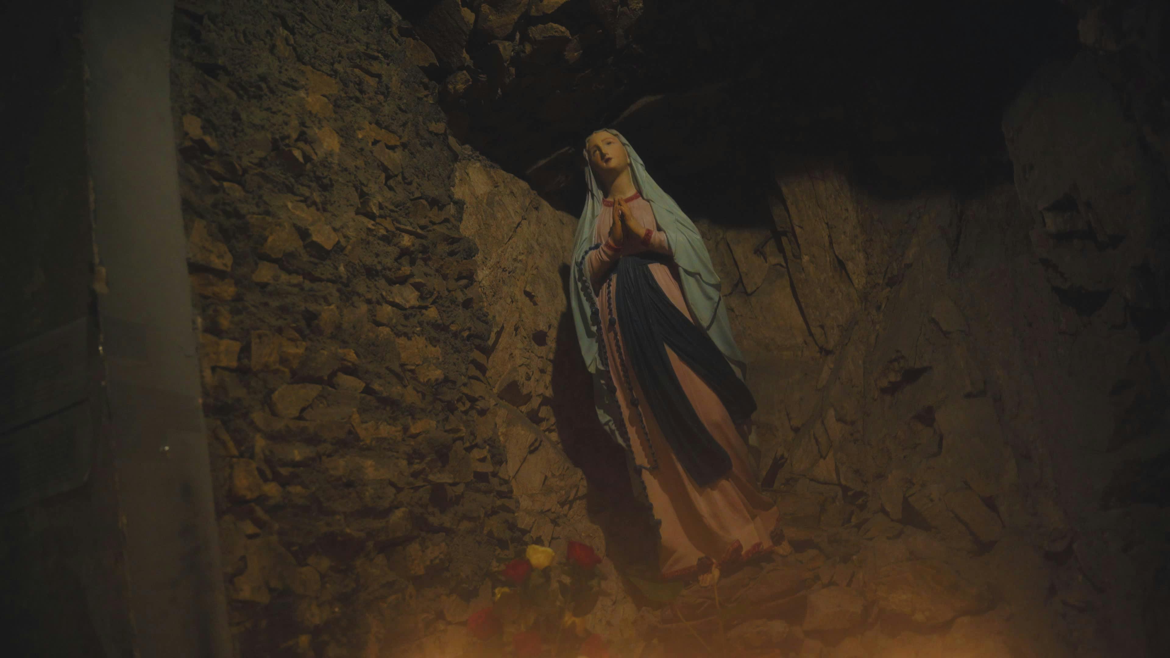 Serene Candlelit Prayer Scene in Grotto Free Stock Video Footage ...