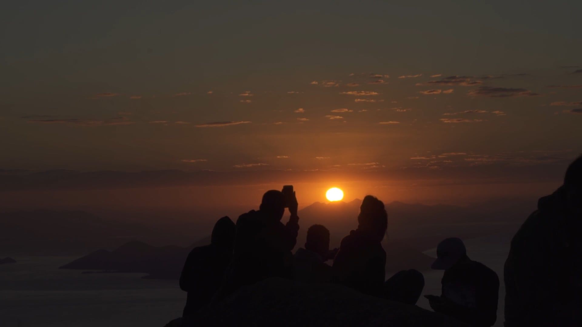 Group Of People On A Hilltop Taking Footage Of The Sunset View Free ...