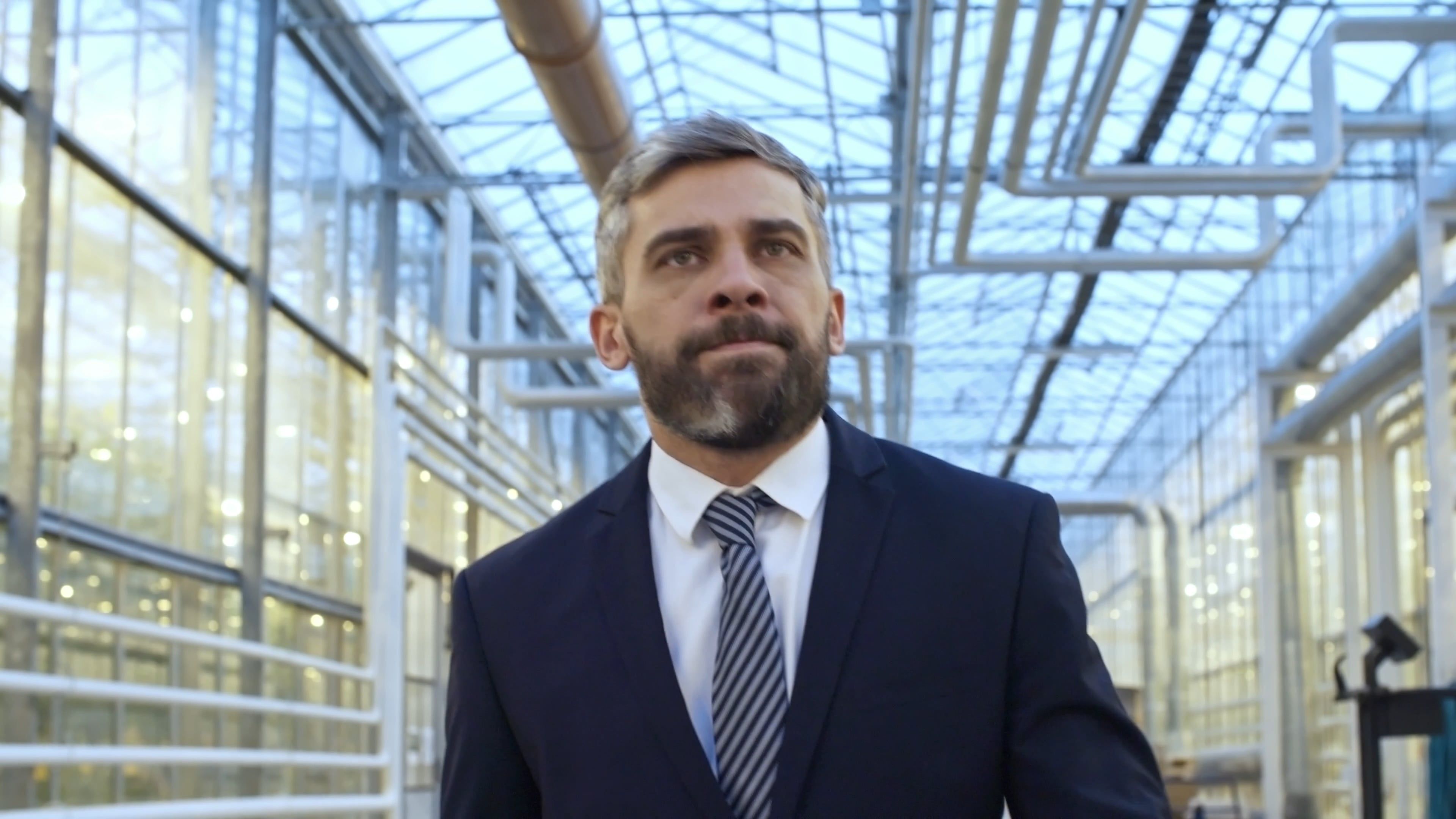 A Man Walking Inside A Production Plant · Free Stock Video