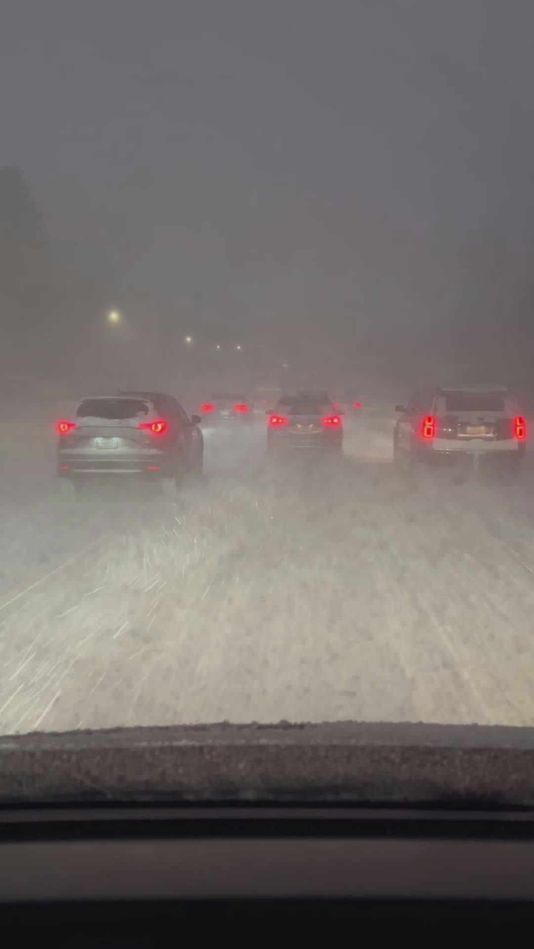 Snowstorm Traffic: Cars Navigating a Blizzard Free Stock Video Footage ...
