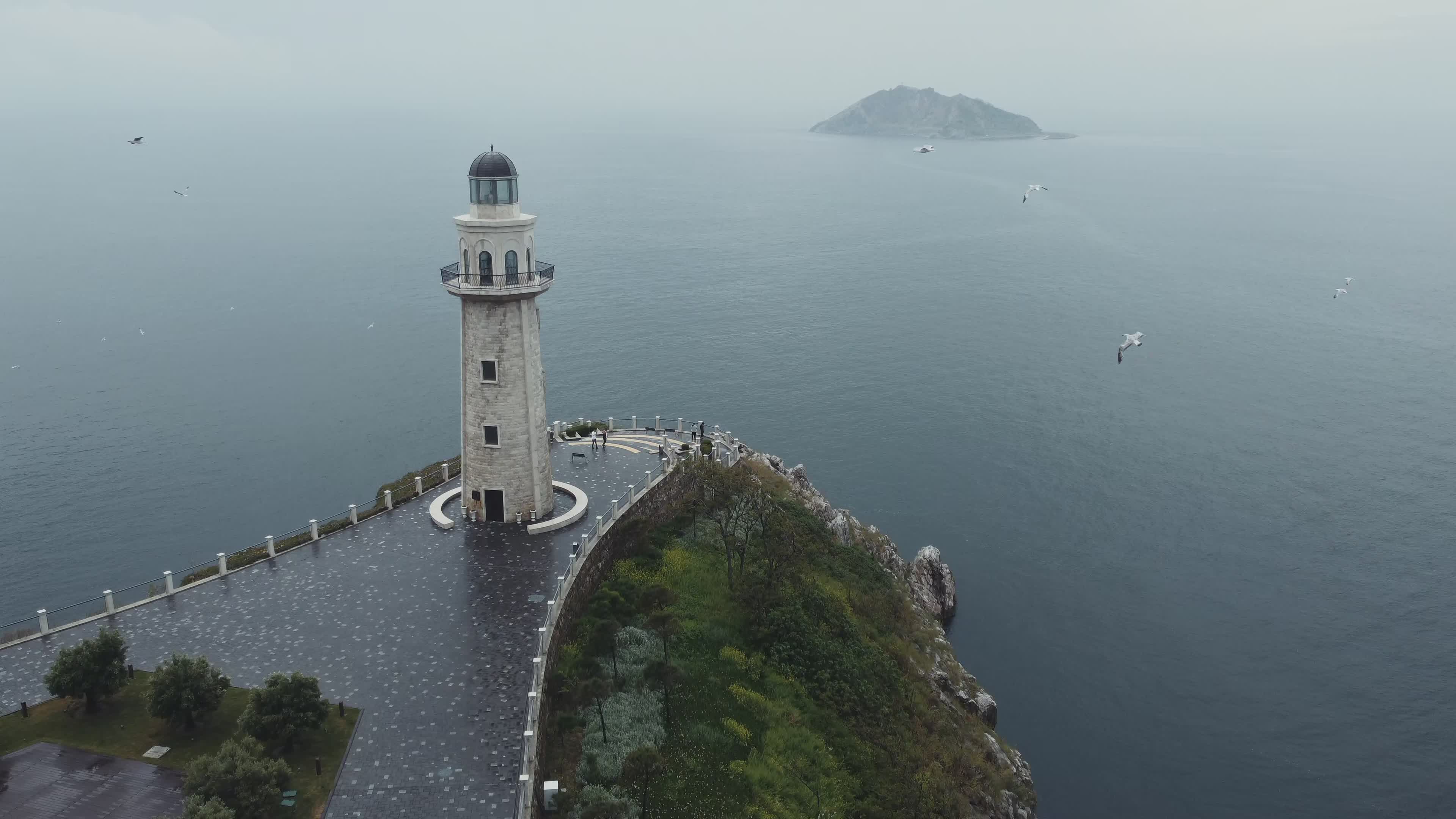 Aerial View of Scenic Island Lighthouse in Fog Free Stock Video Footage ...