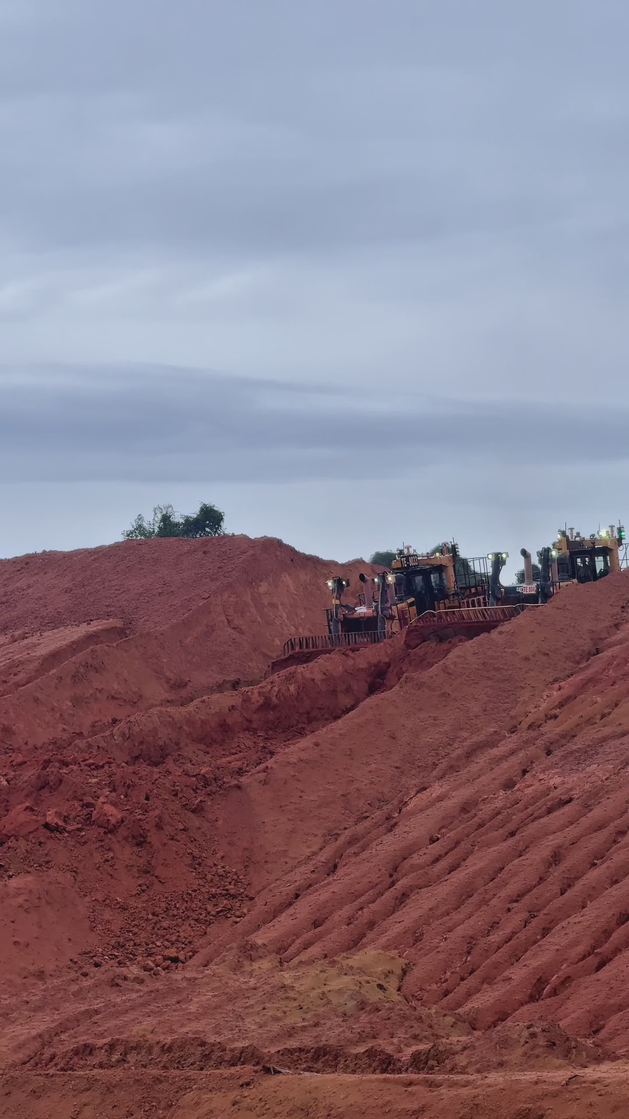 Heavy Machinery Operating on Red Earth Hills Free Stock Video Footage ...