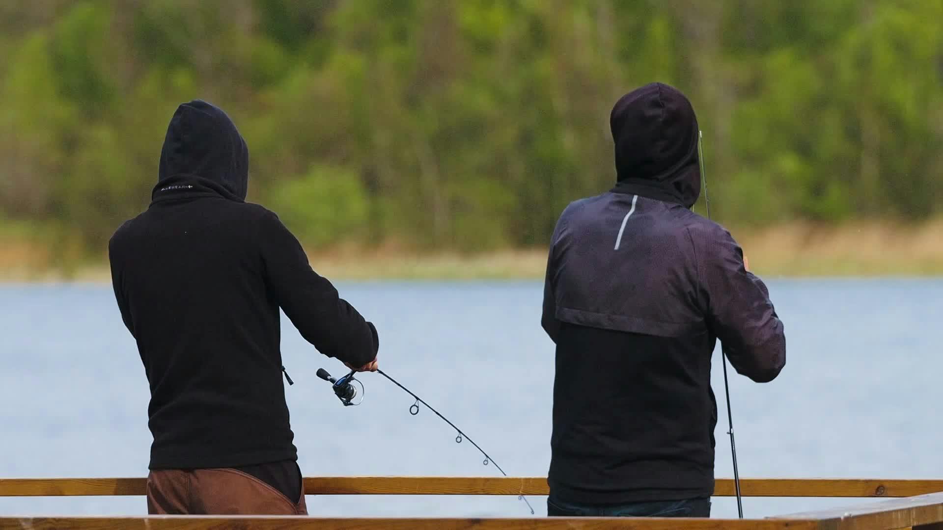 Two Friends Fishing on a Tranquil Lake Free Stock Video Footage ...