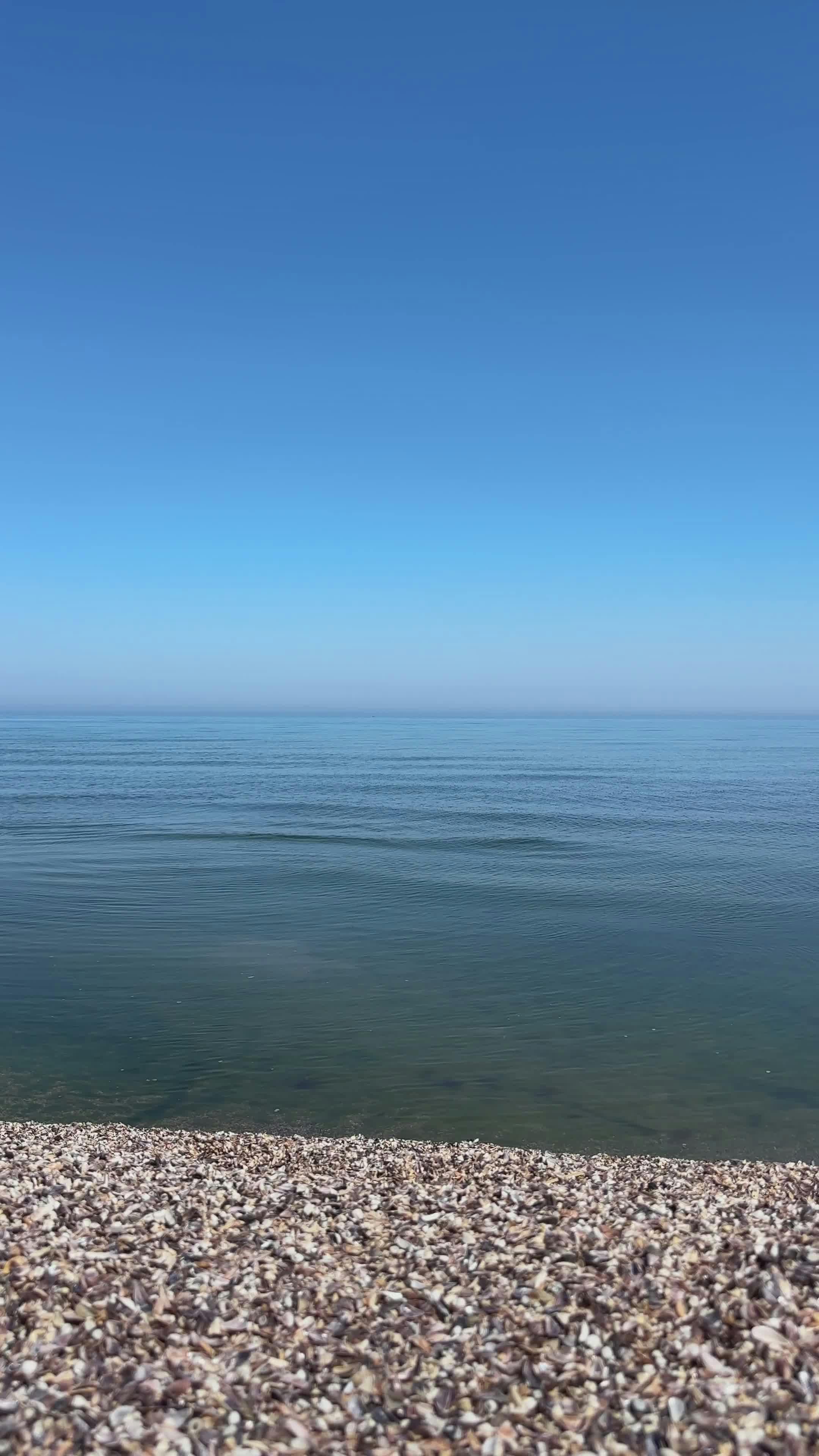 Tranquil Pebble Beach and Calm Sea View Free Stock Video Footage ...