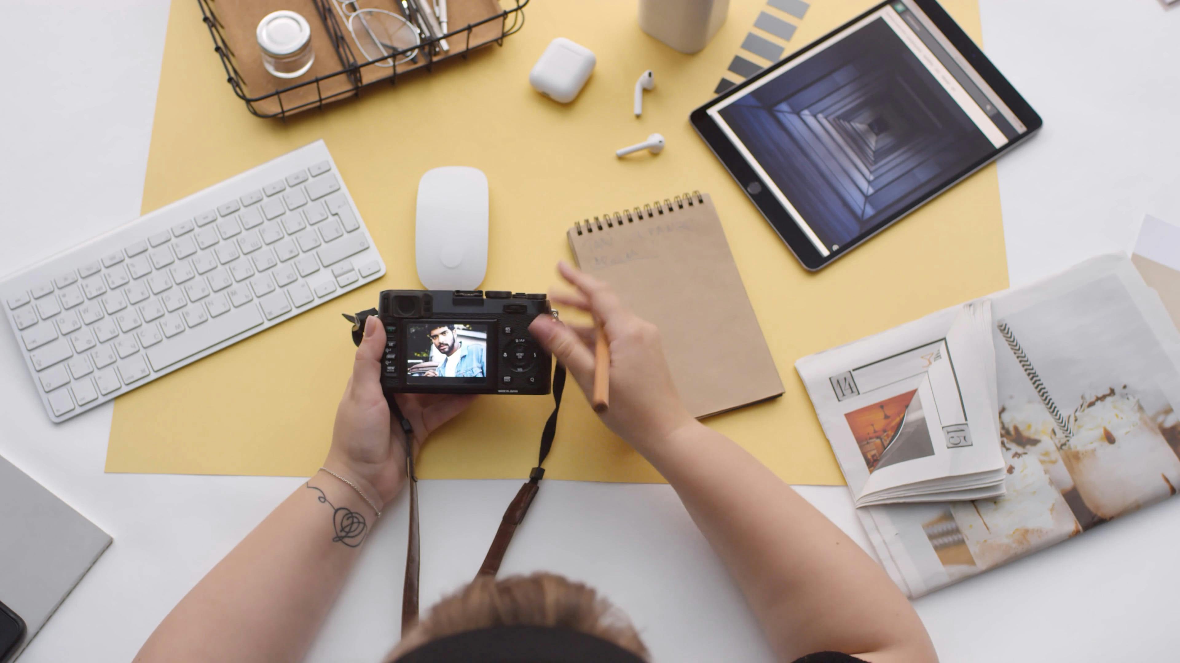 A Person Reviewing The Pictures Taken From A Digital Camera · Free ...