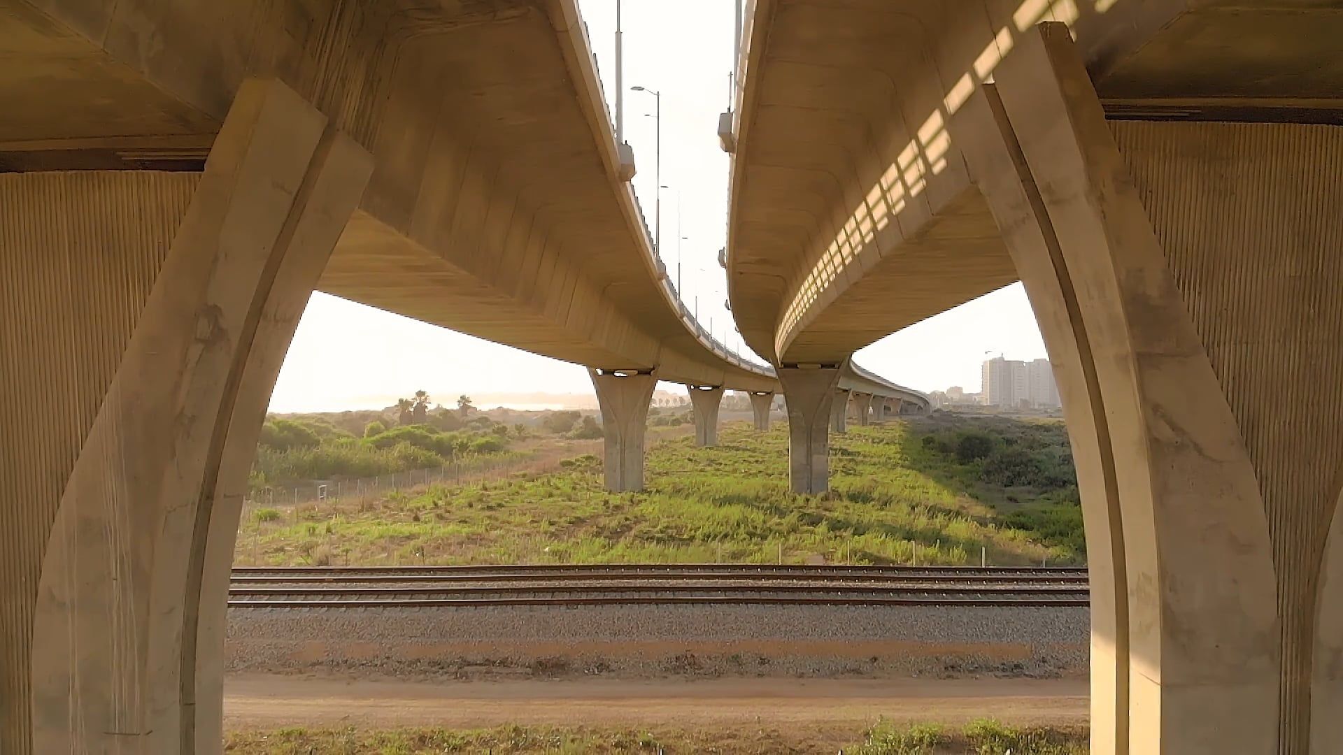 A Railway Under A Flyover · Free Stock Video