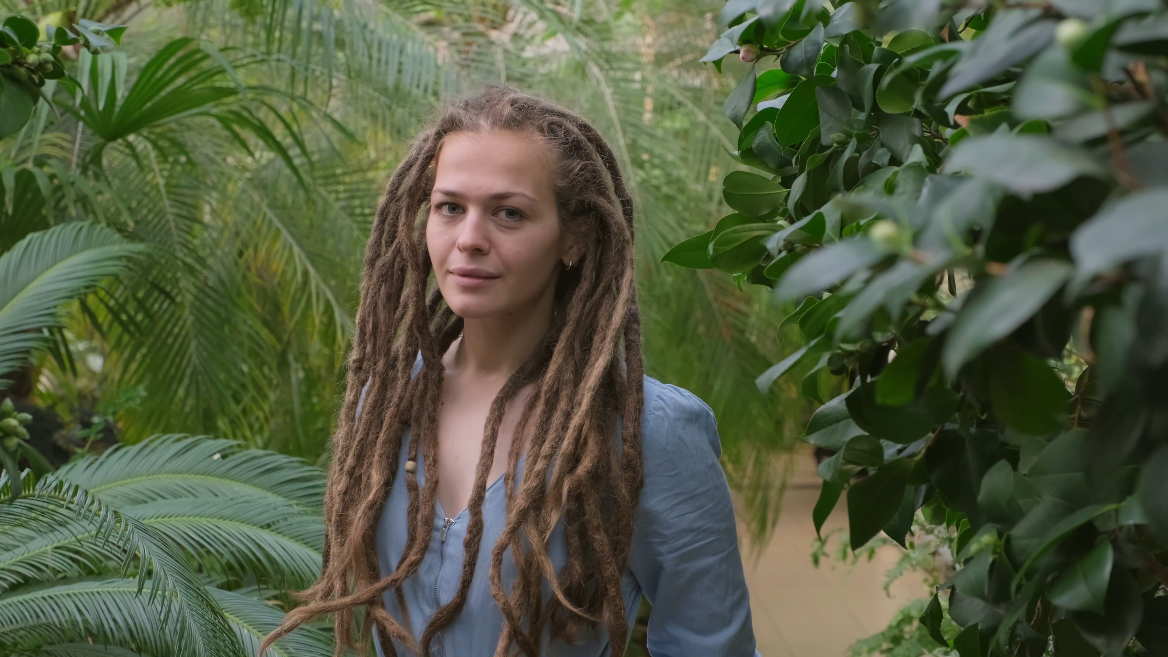 A Woman Breaking Gently Into A Smile · Free Stock Video