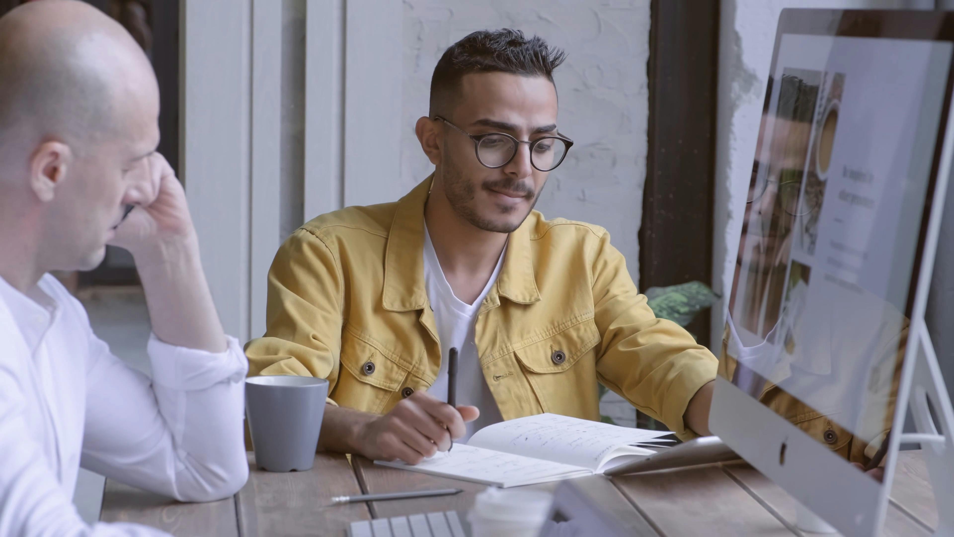 Men Busy In Their Workplace Aided By Using Modern Technology Gadgets ...