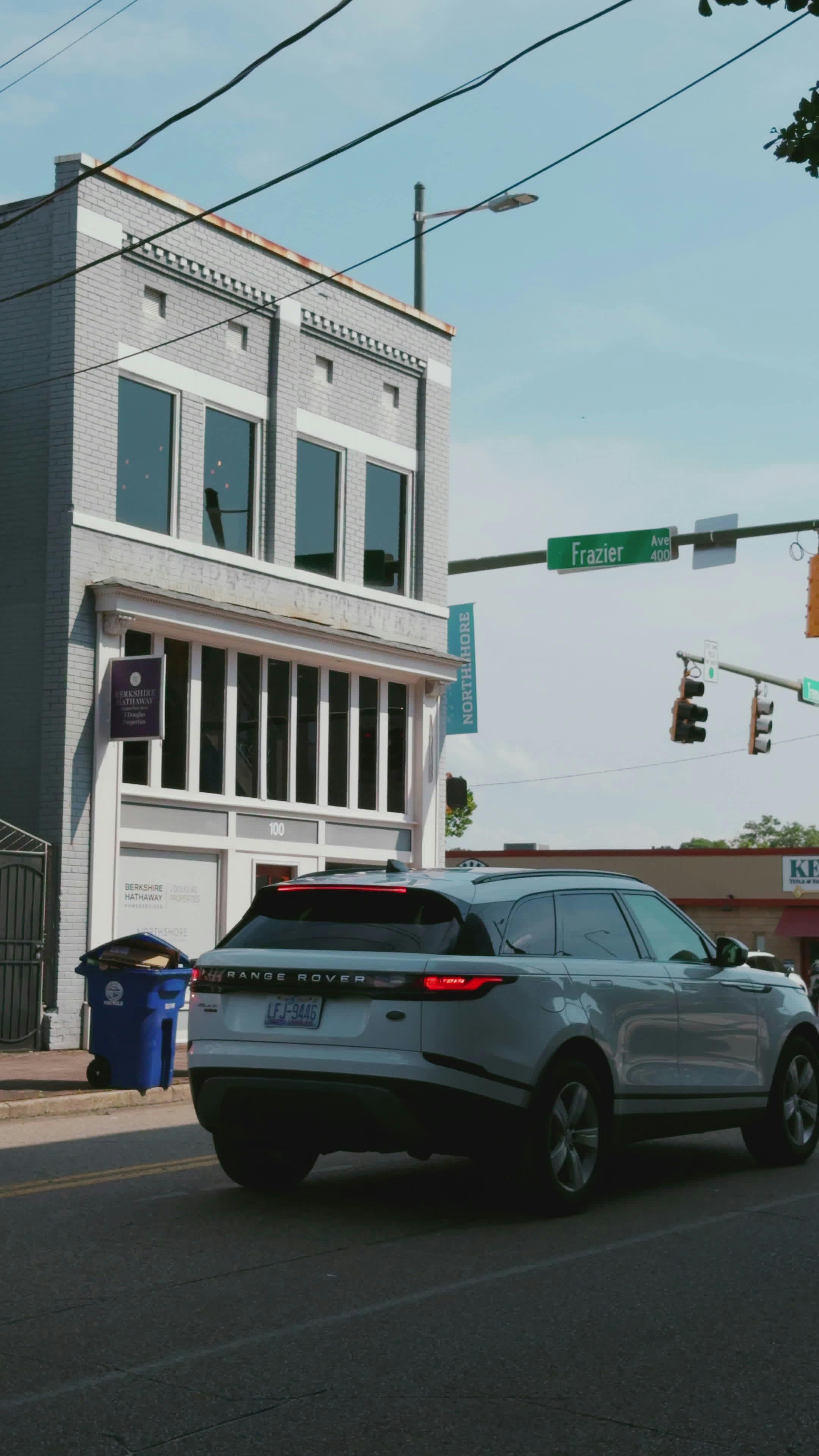 Urban Traffic Scene with Modern Car and Storefronts Free Stock Video ...