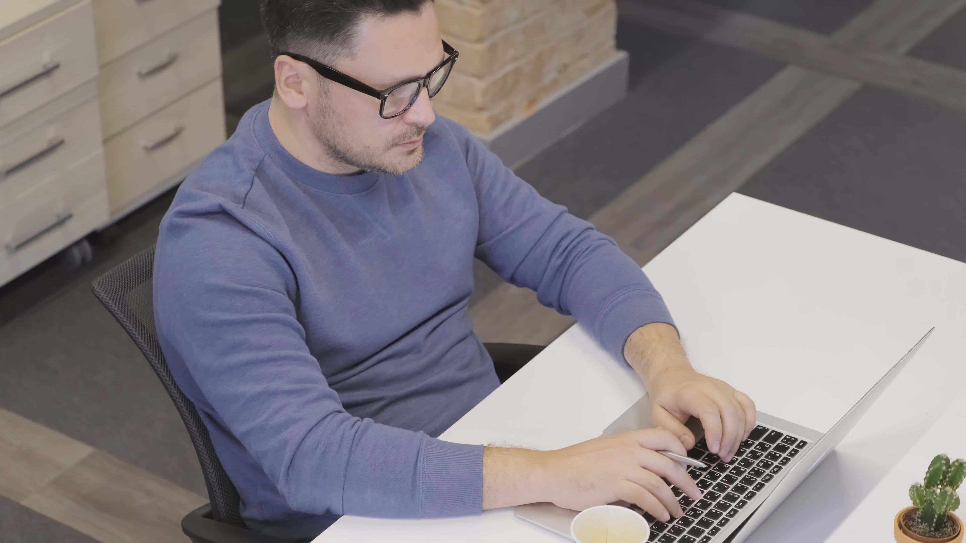 Man Having Coffee While Working In The Office · Free Stock Video