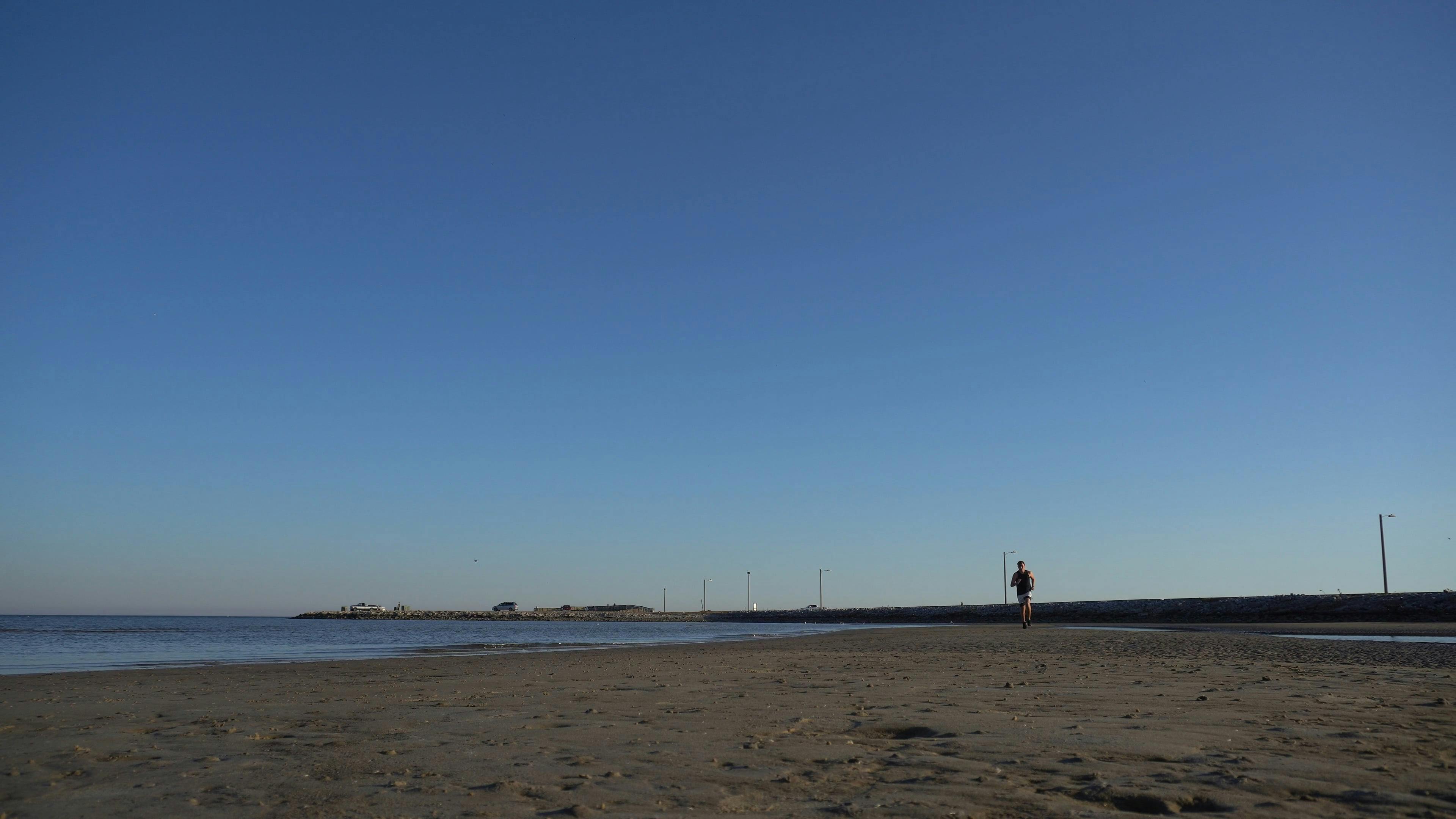 A Man Running On A Sea Shoreline Free Stock Video Footage, Royalty-Free ...
