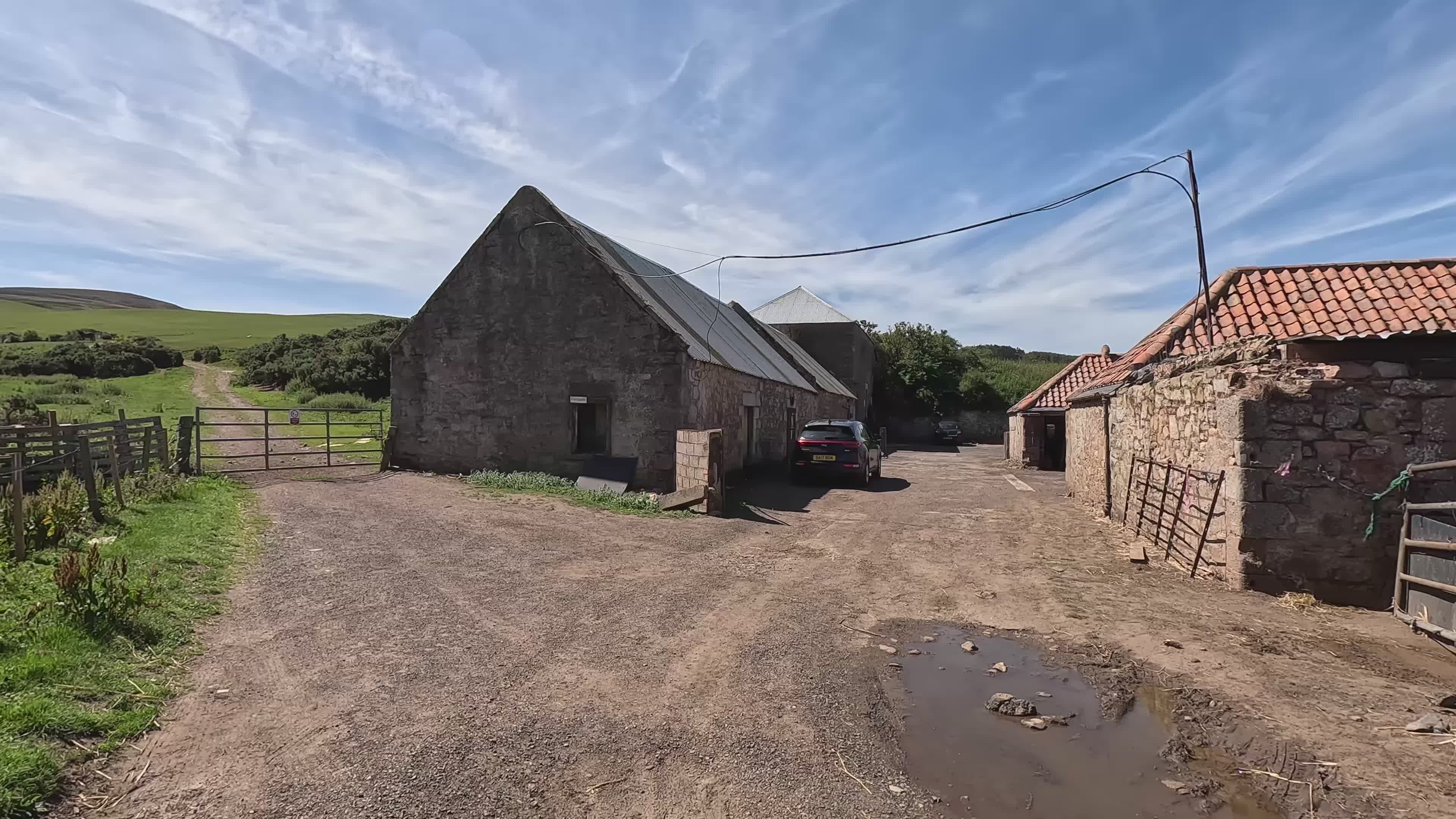 Rustic Farmyard with Stone Barns and Open Gate Free Stock Video Footage ...