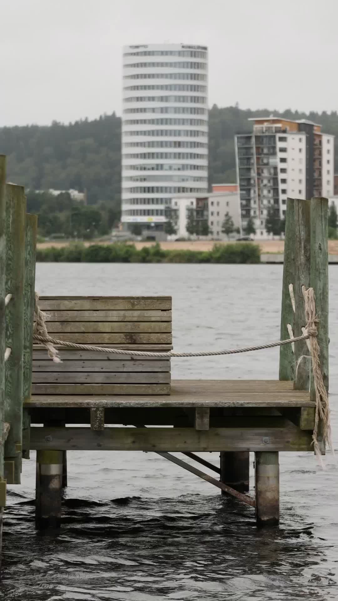 Scenic Lakeside View with Pier and City Buildings Free Stock Video ...