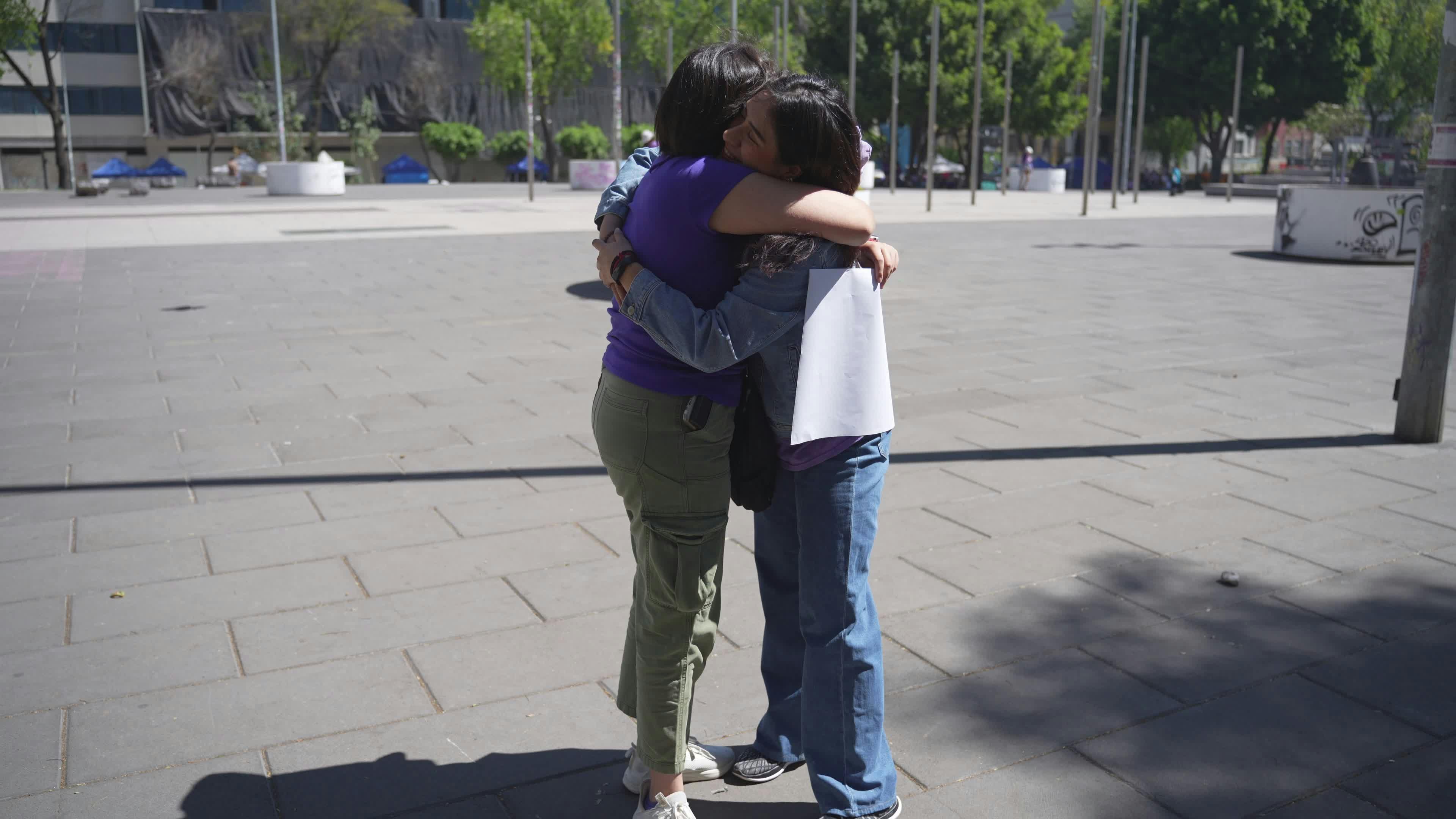 Heartwarming Hug in Urban Plaza Free Stock Video Footage, Royalty-Free ...