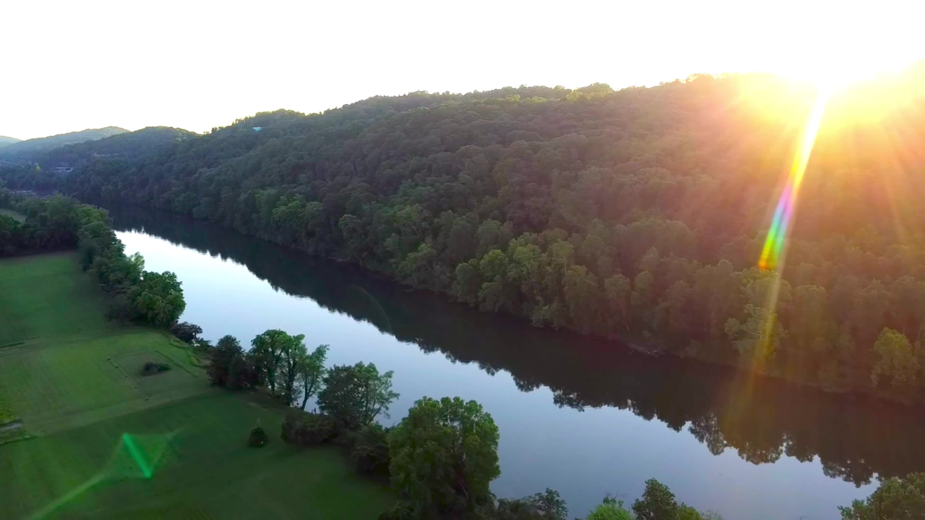 Scenic Aerial View of River and Forest at Sunrise Free Stock Video ...