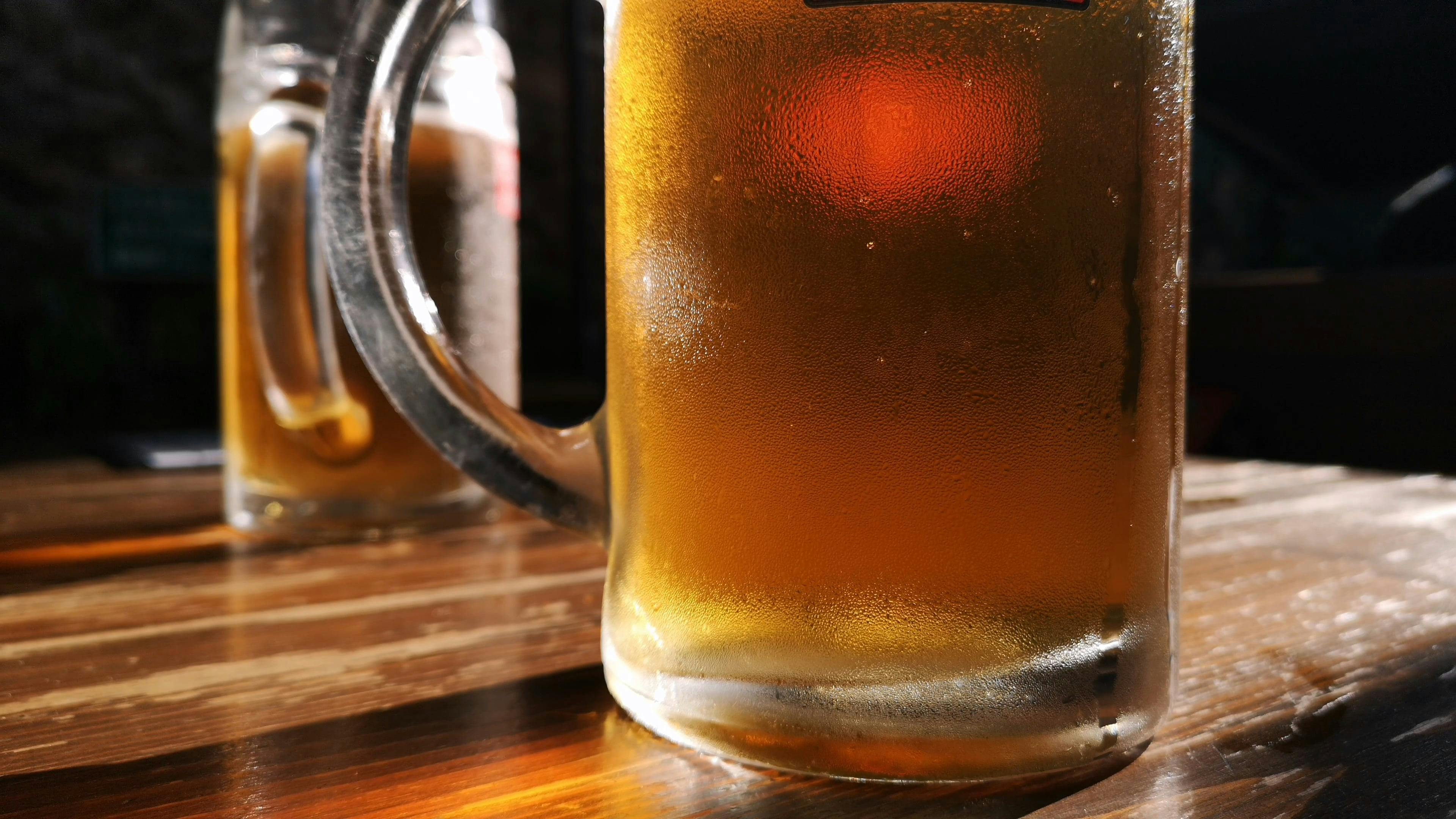 A Mug Of Cold Draft Beers On Top Of A Table · Free Stock Video