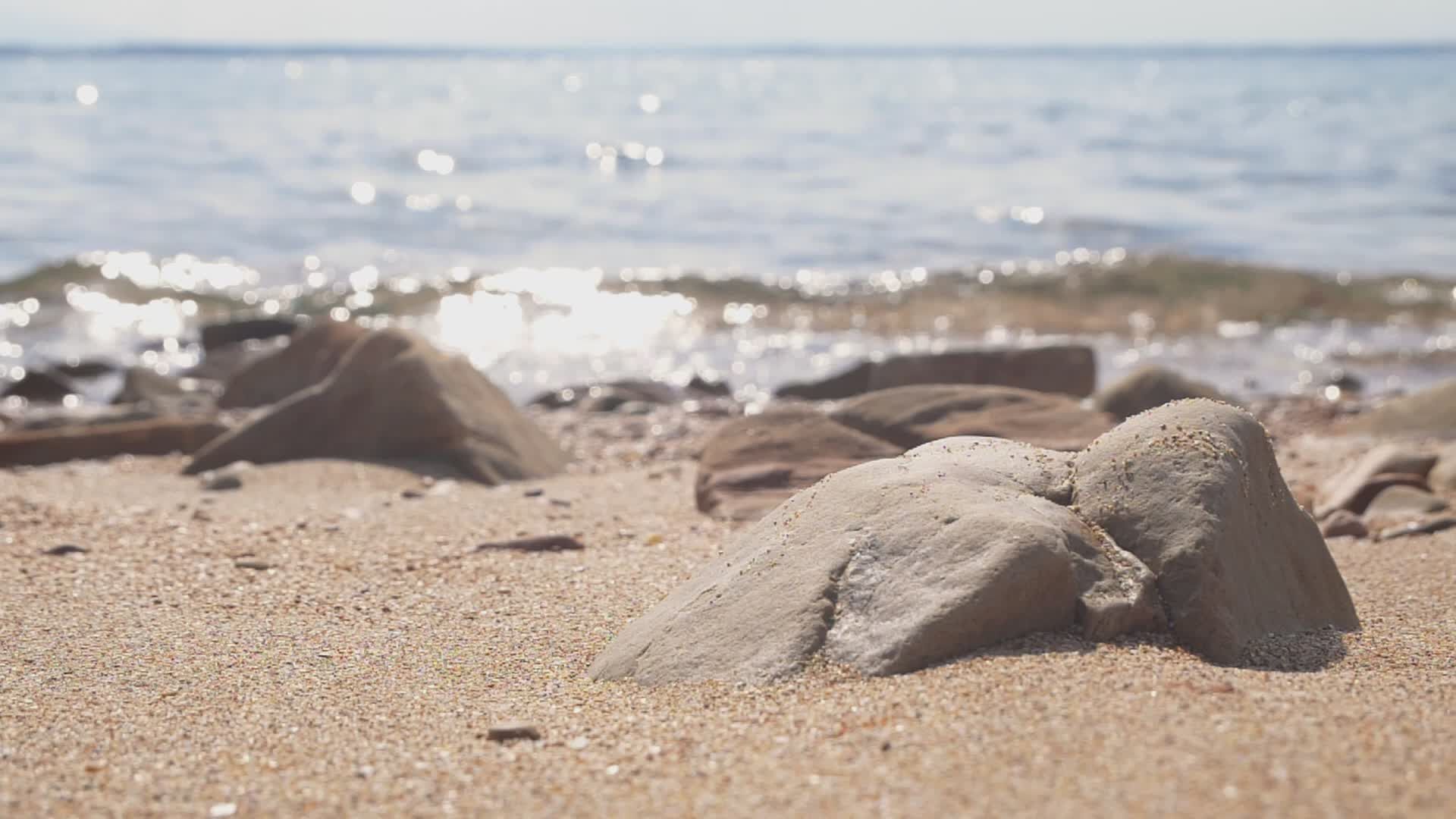 Serene Seashore with Gentle Waves and Rocks Free Stock Video Footage ...