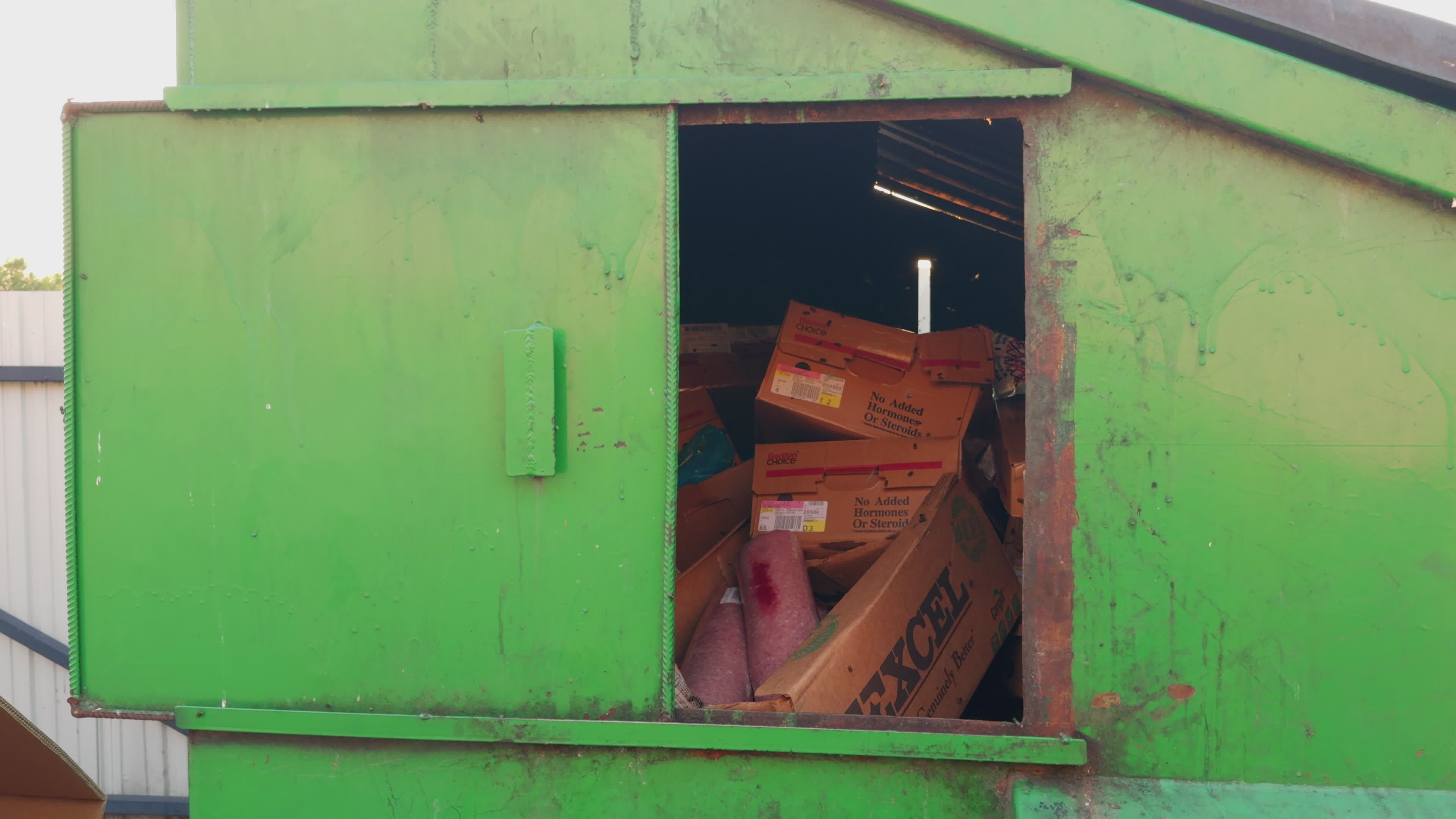 Green Dumpster Filled with Cardboard Waste Free Stock Video Footage ...