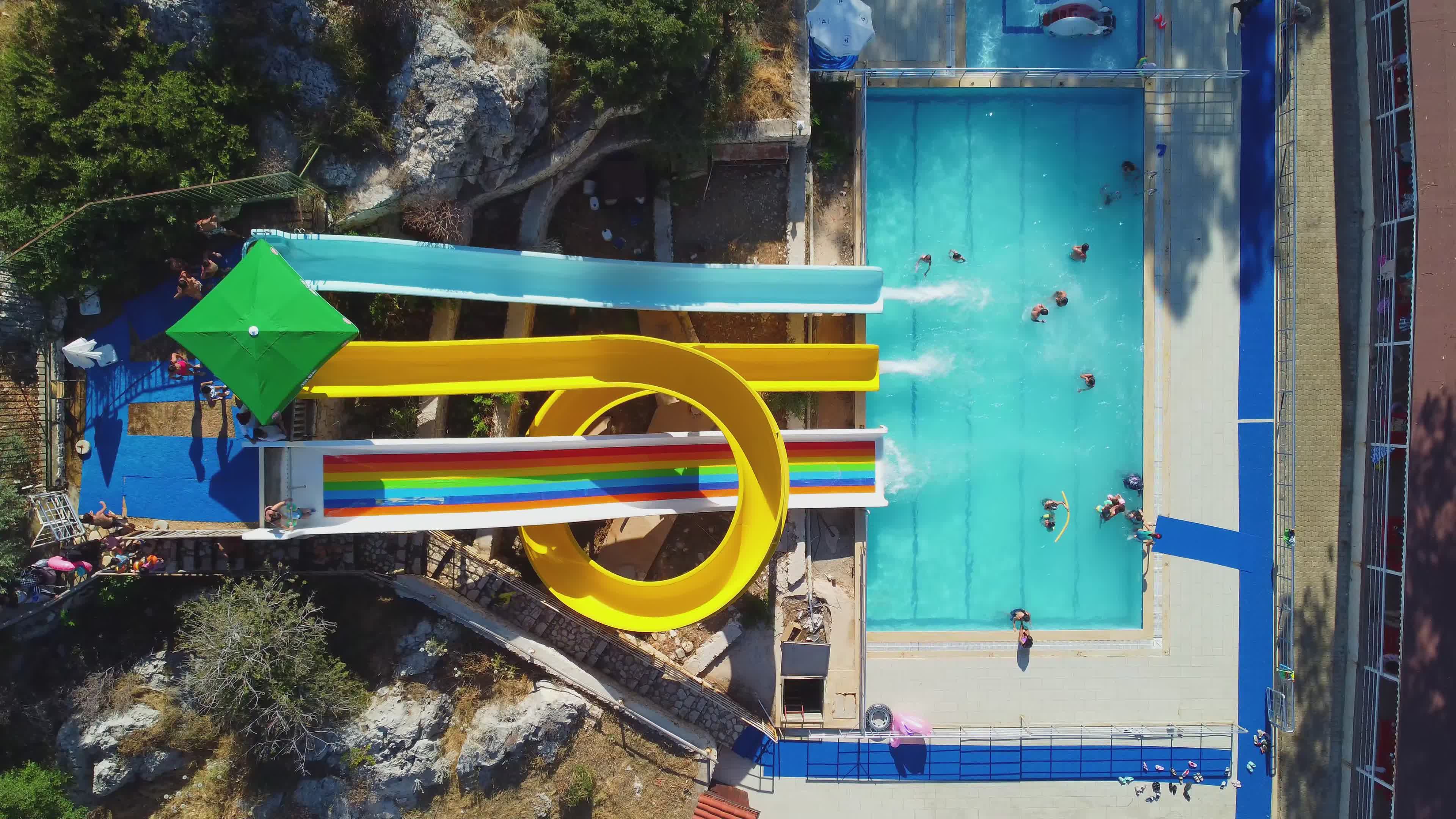 Aerial View of Vibrant Water Park Slide in Summer Free Stock Video ...