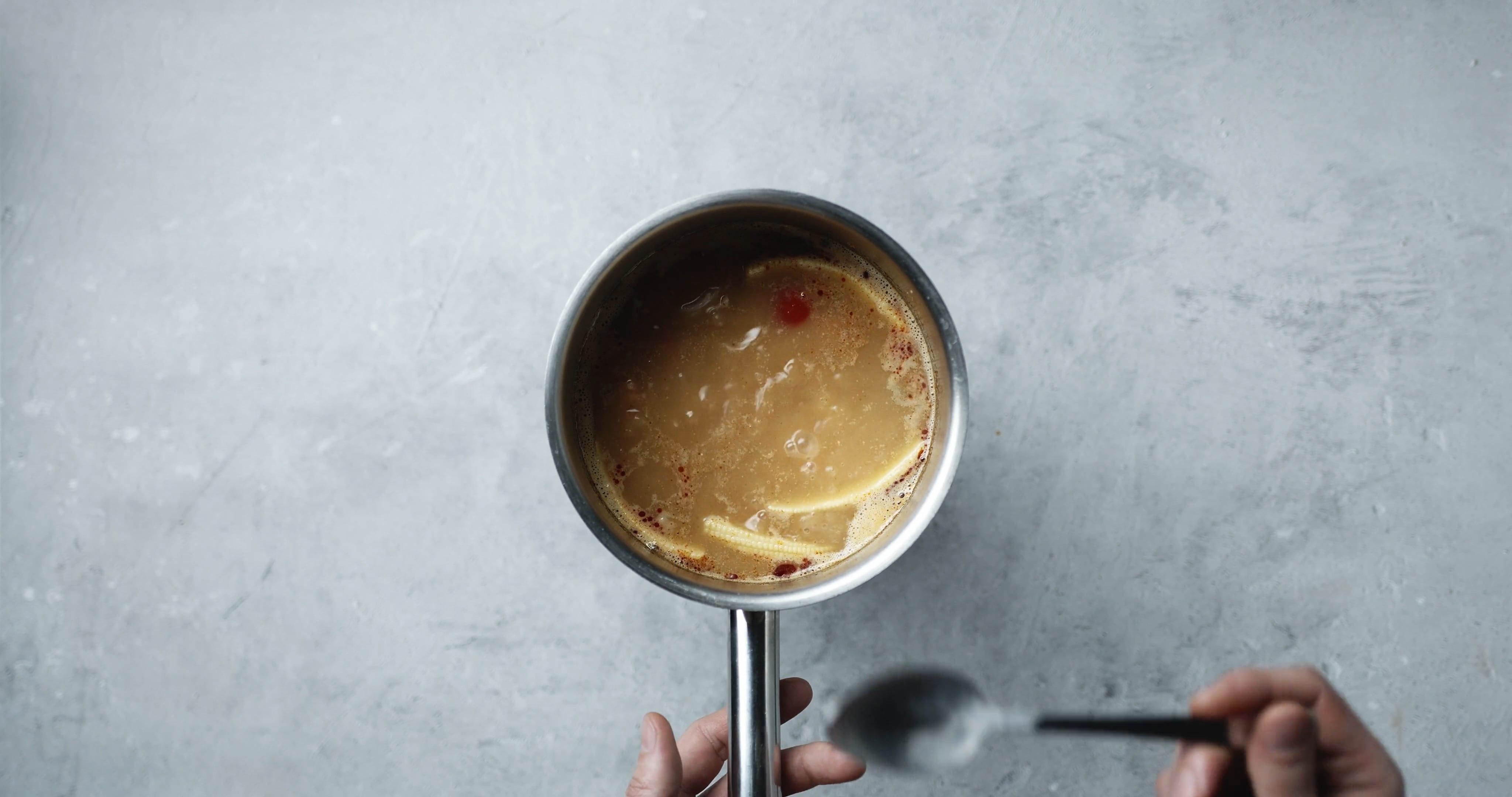 A Chef Grabbing a Spoon To Stir The Soup In Hot Pot · Free Stock Video