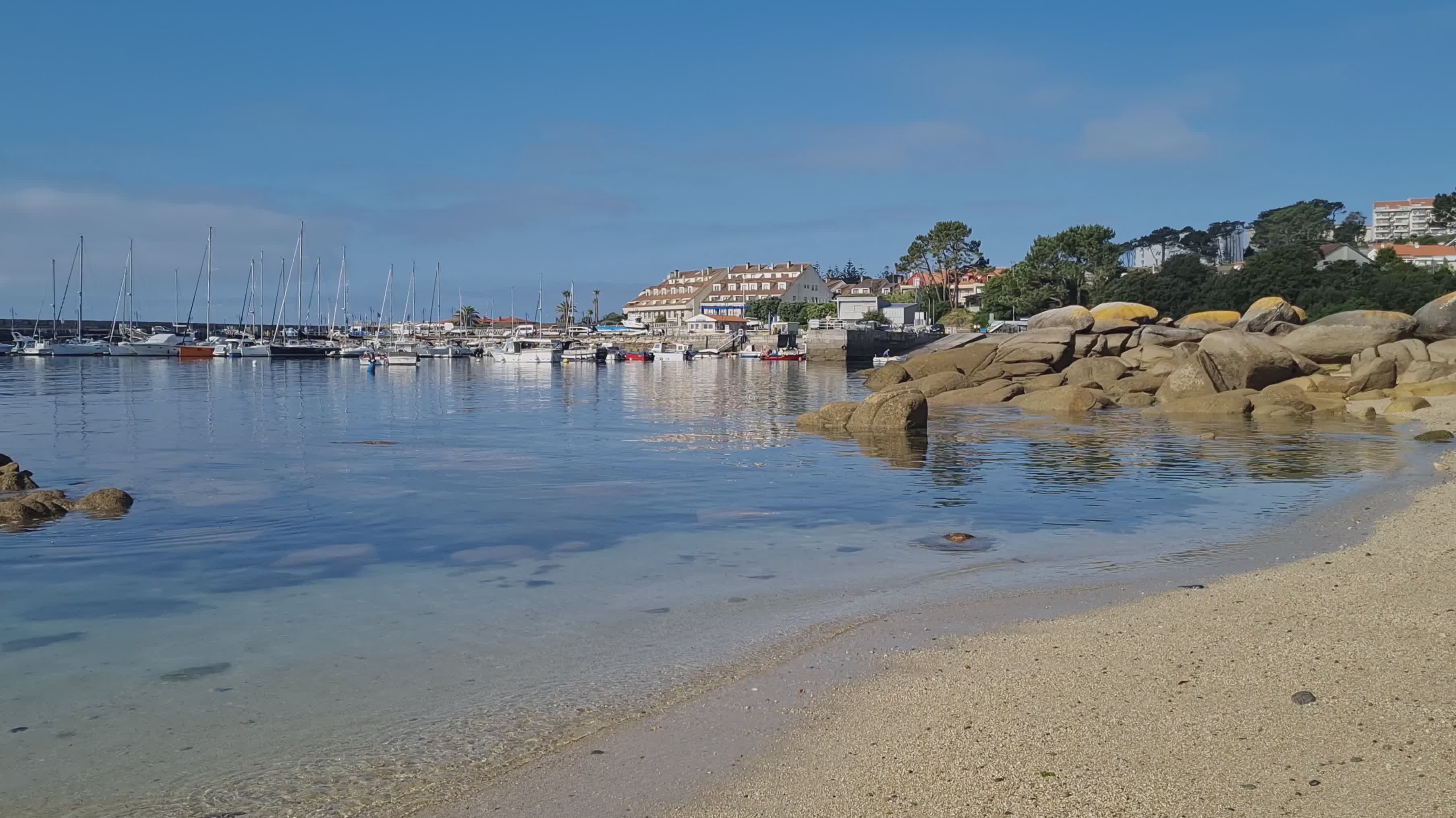 Scenic Beachfront Marina with Boats and Rocks Free Stock Video Footage ...