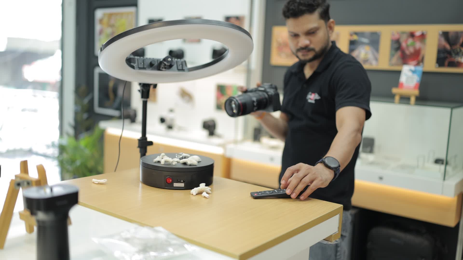 Professional Photographer Adjusting Camera Setup Indoors Free Stock ...