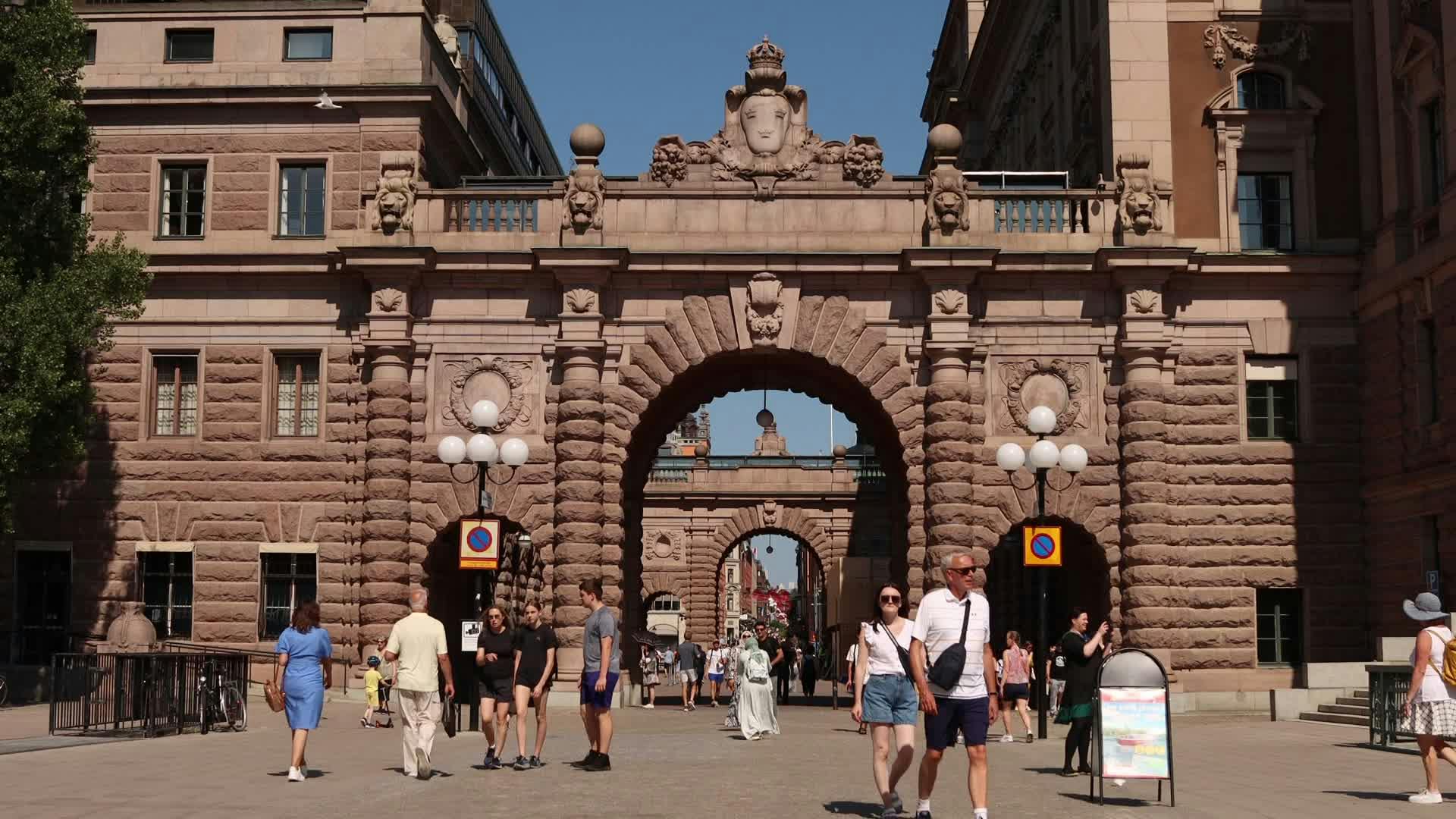 Pedestrians Walk Through Historic Stockholm Archway Free Stock Video ...