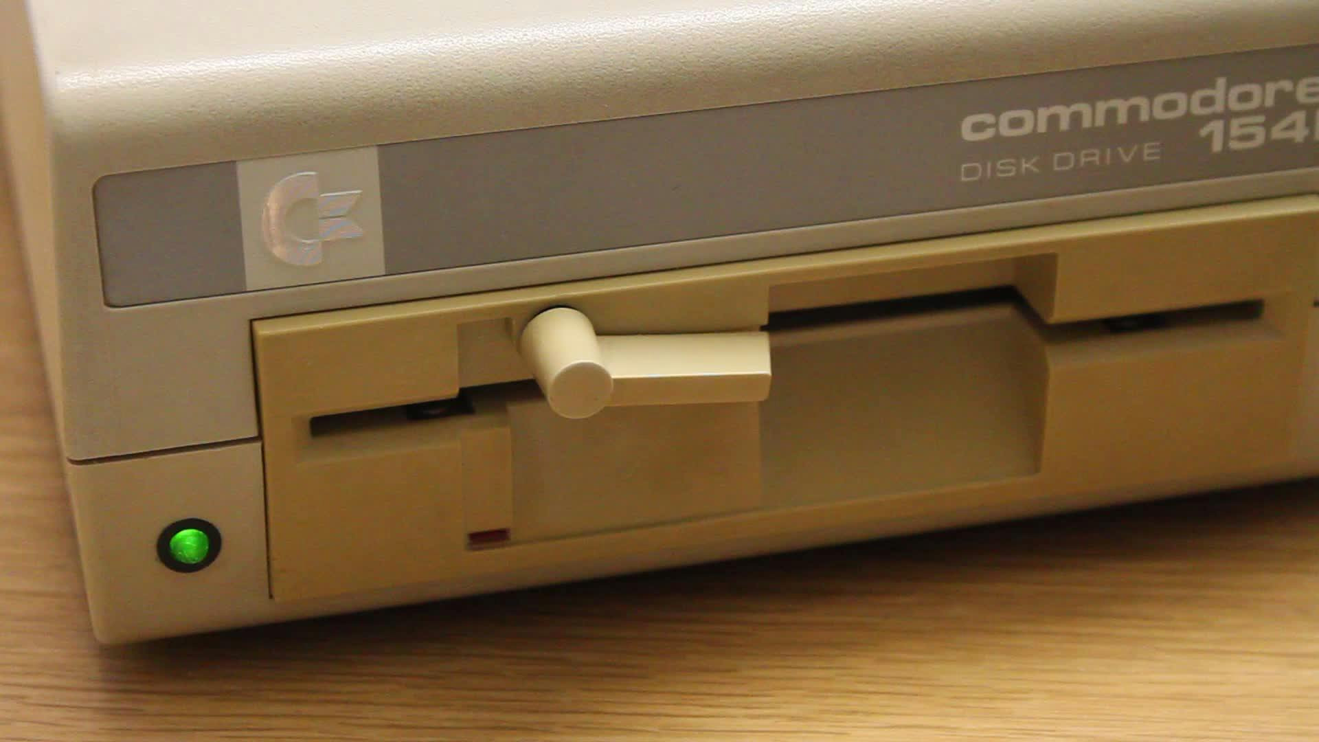 Inserting Floppy Disk into Vintage Commodore 1541 Free Stock Video ...