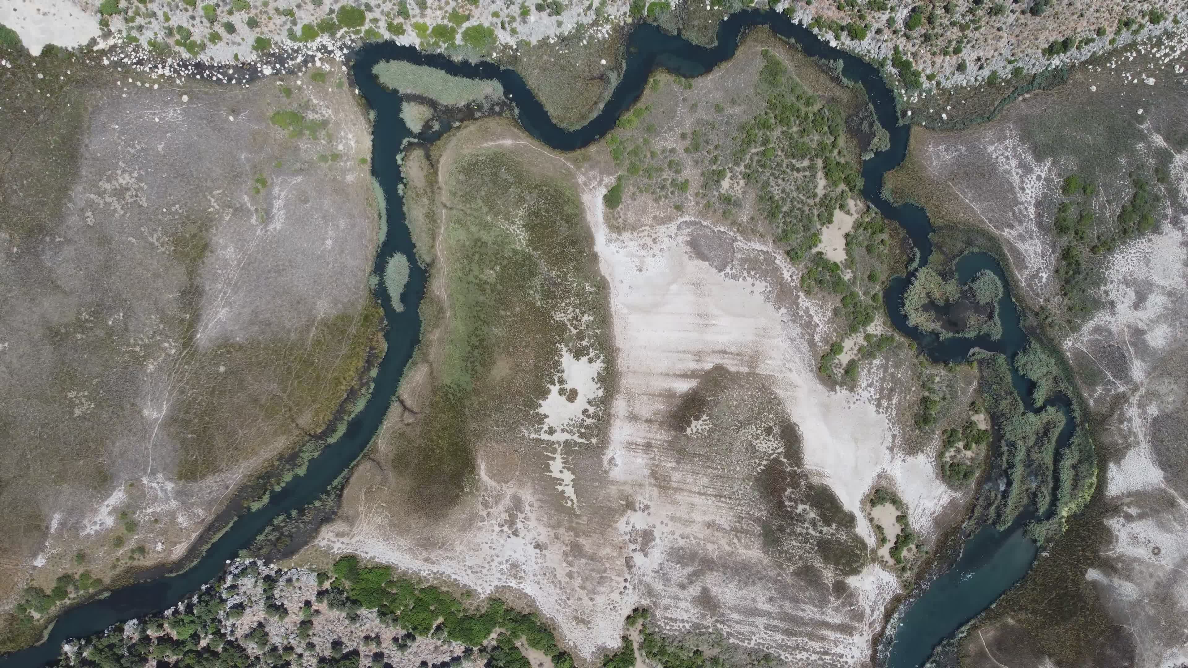 Aerial View of Meandering River and Barren Landscape Free Stock Video ...